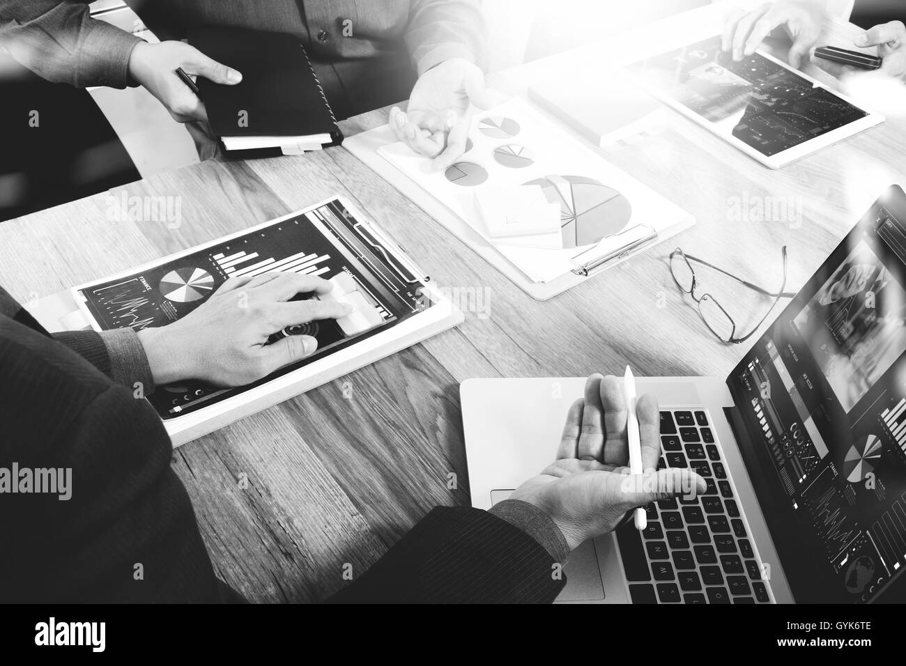 Business colleagues review laptop Black and White Stock Photos & Images ...