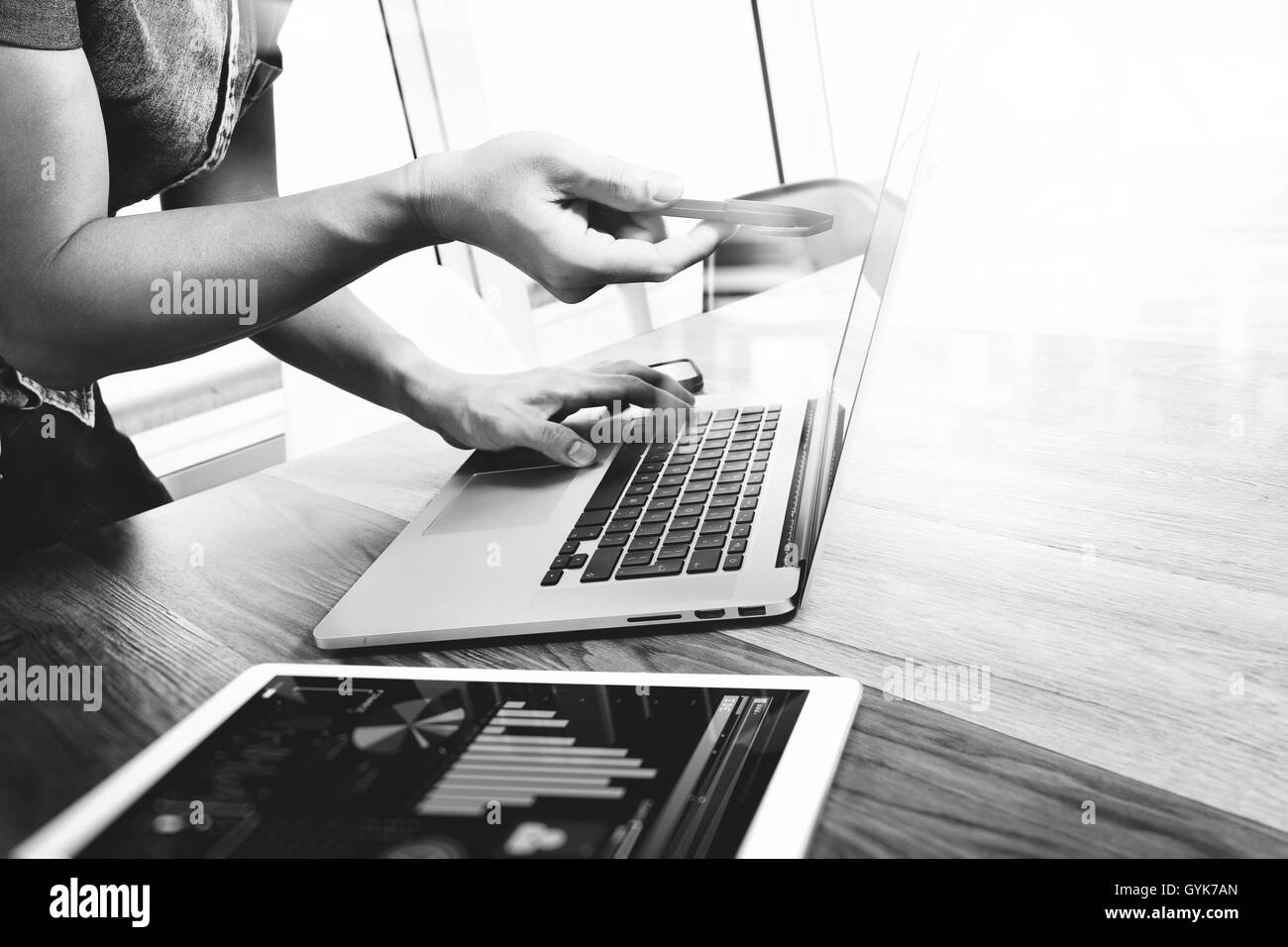 Businessman hand touching digital tablet.Photo finance manager working ...