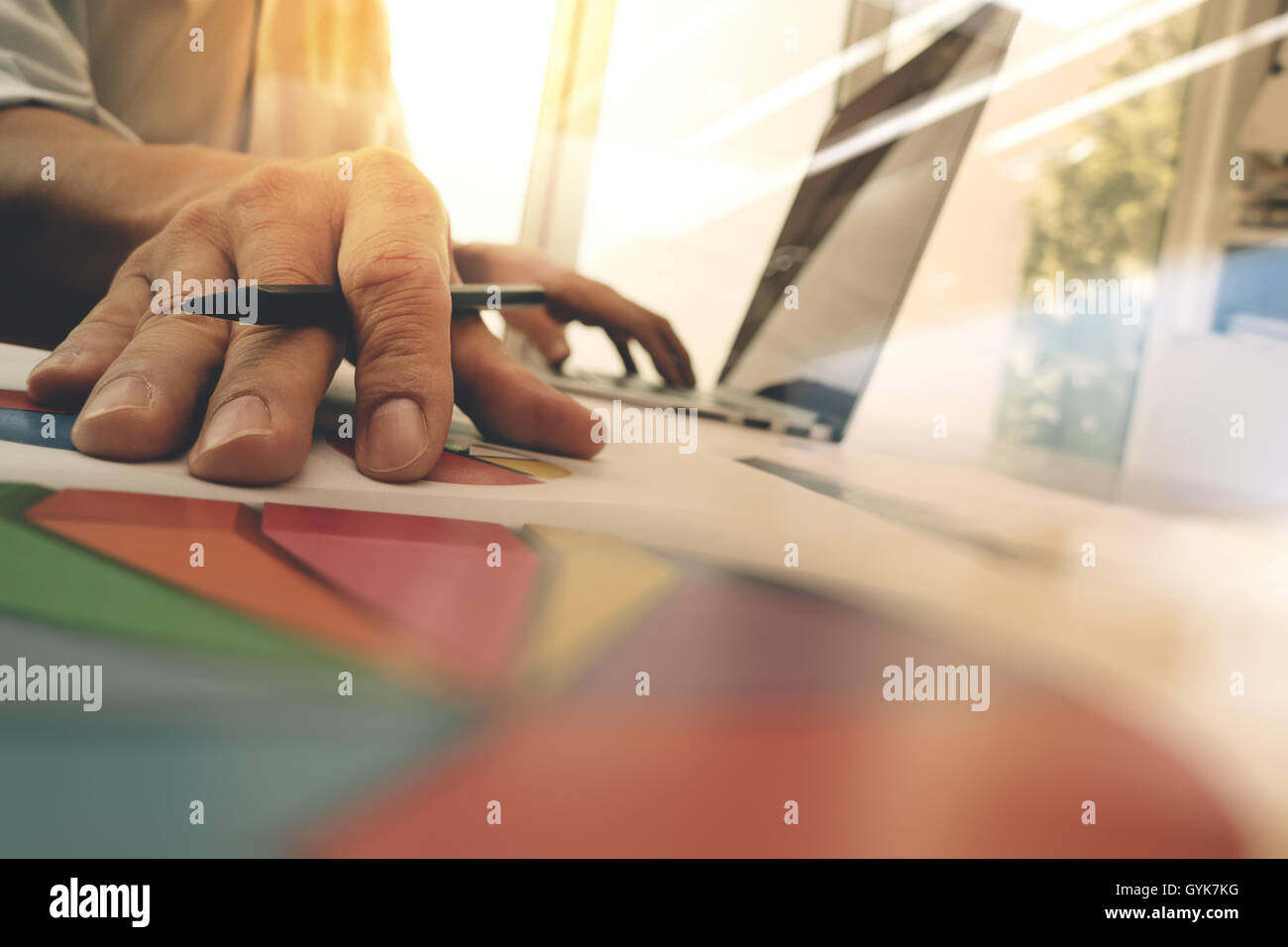 business man hand working on laptop computer with digital layer ...