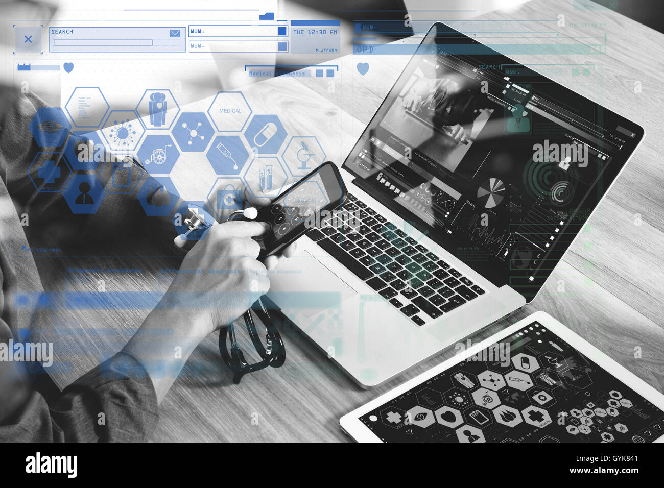 Doctor working with digital tablet and laptop computer with smart phone ...