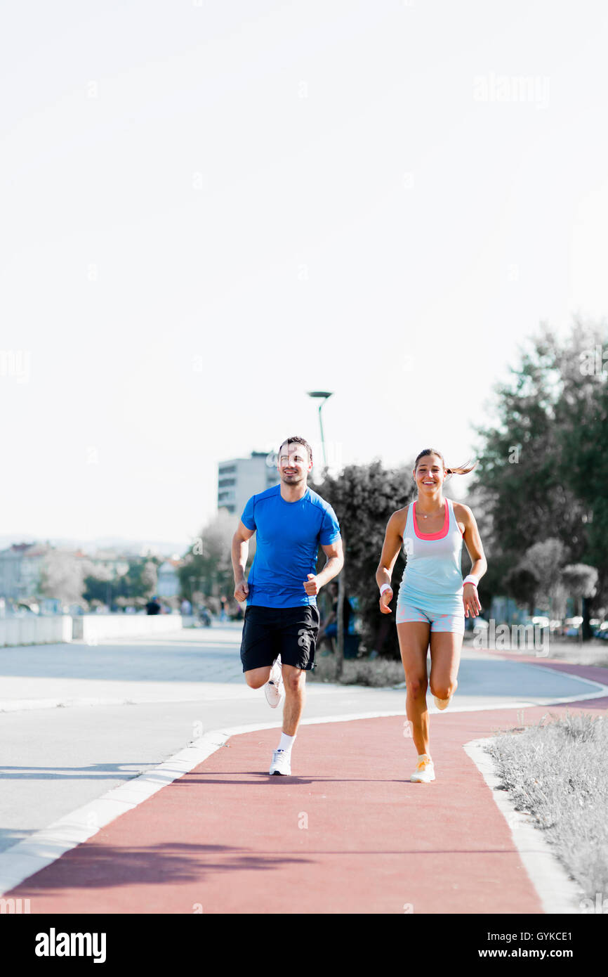 People jogging on track park hi-res stock photography and images - Alamy