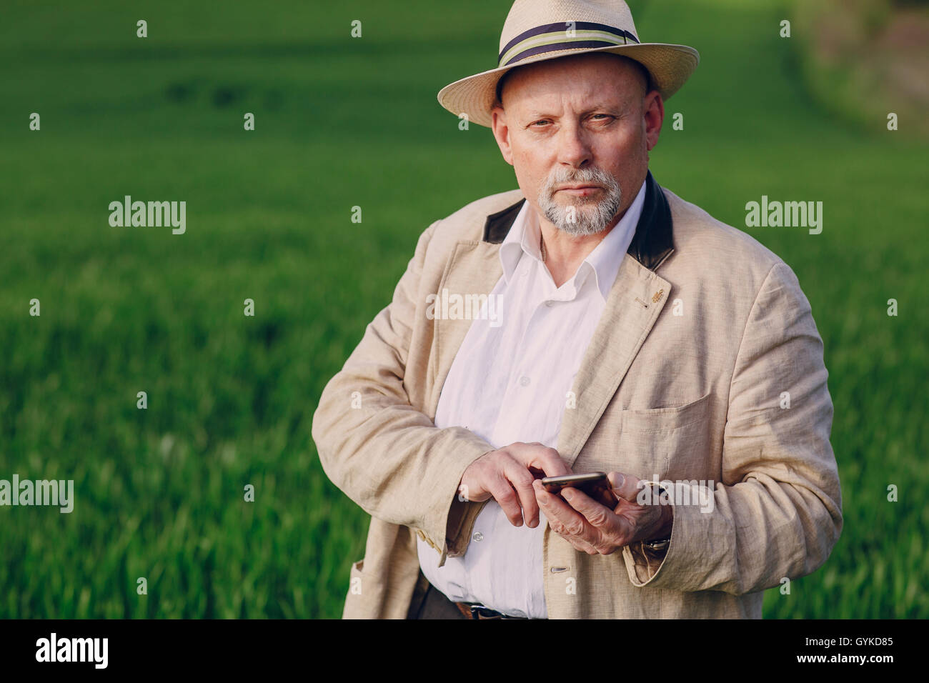 old man in field Stock Photo - Alamy