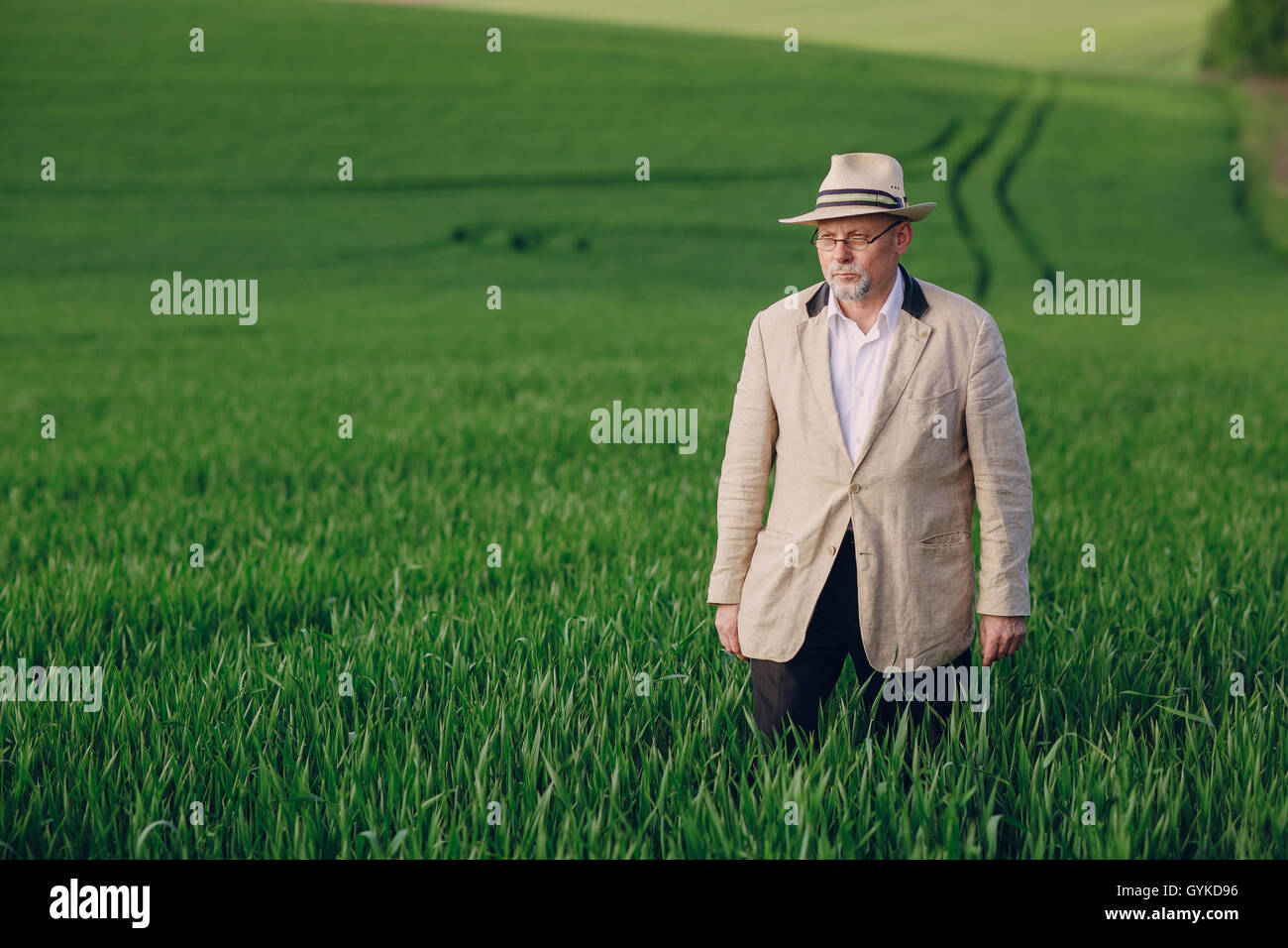 old man in field Stock Photo - Alamy