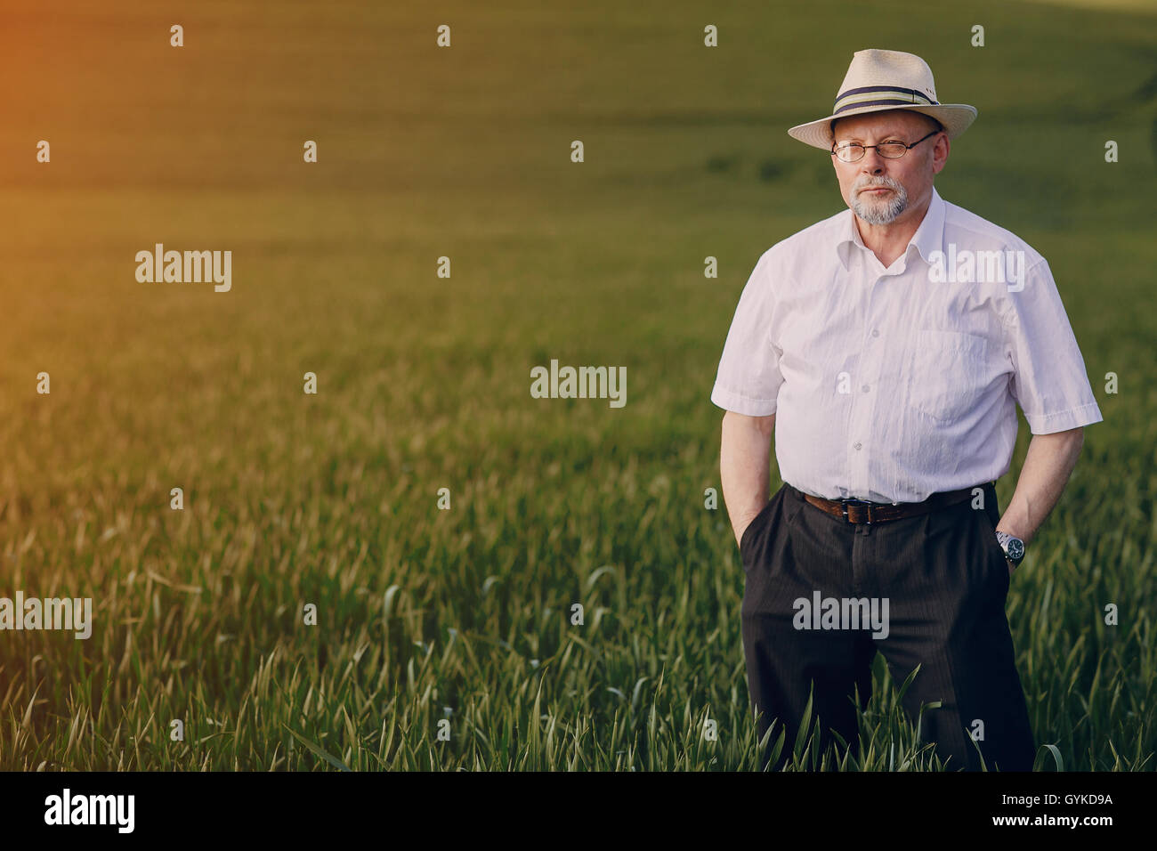 old man in field Stock Photo - Alamy
