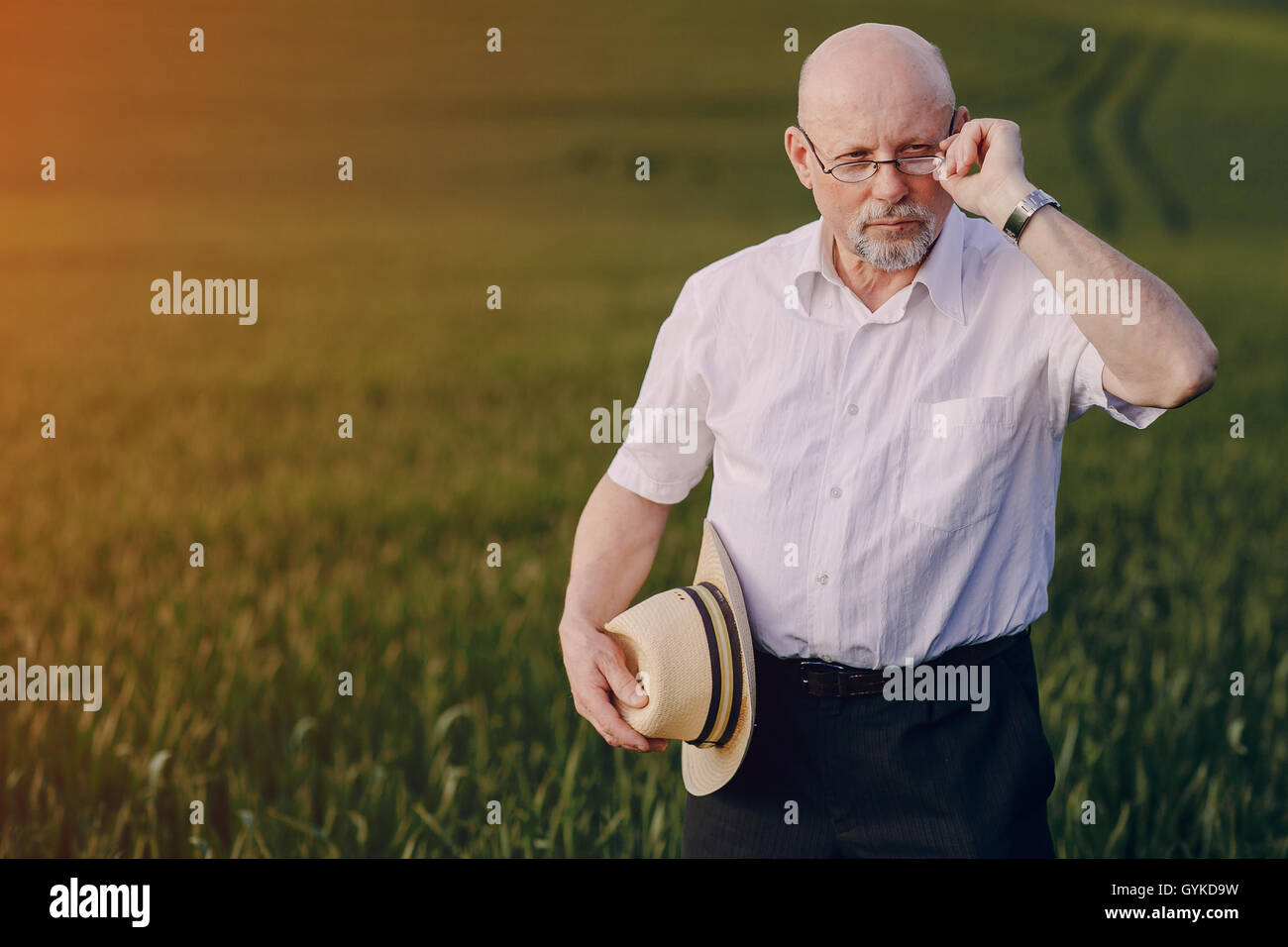old man in field Stock Photo - Alamy