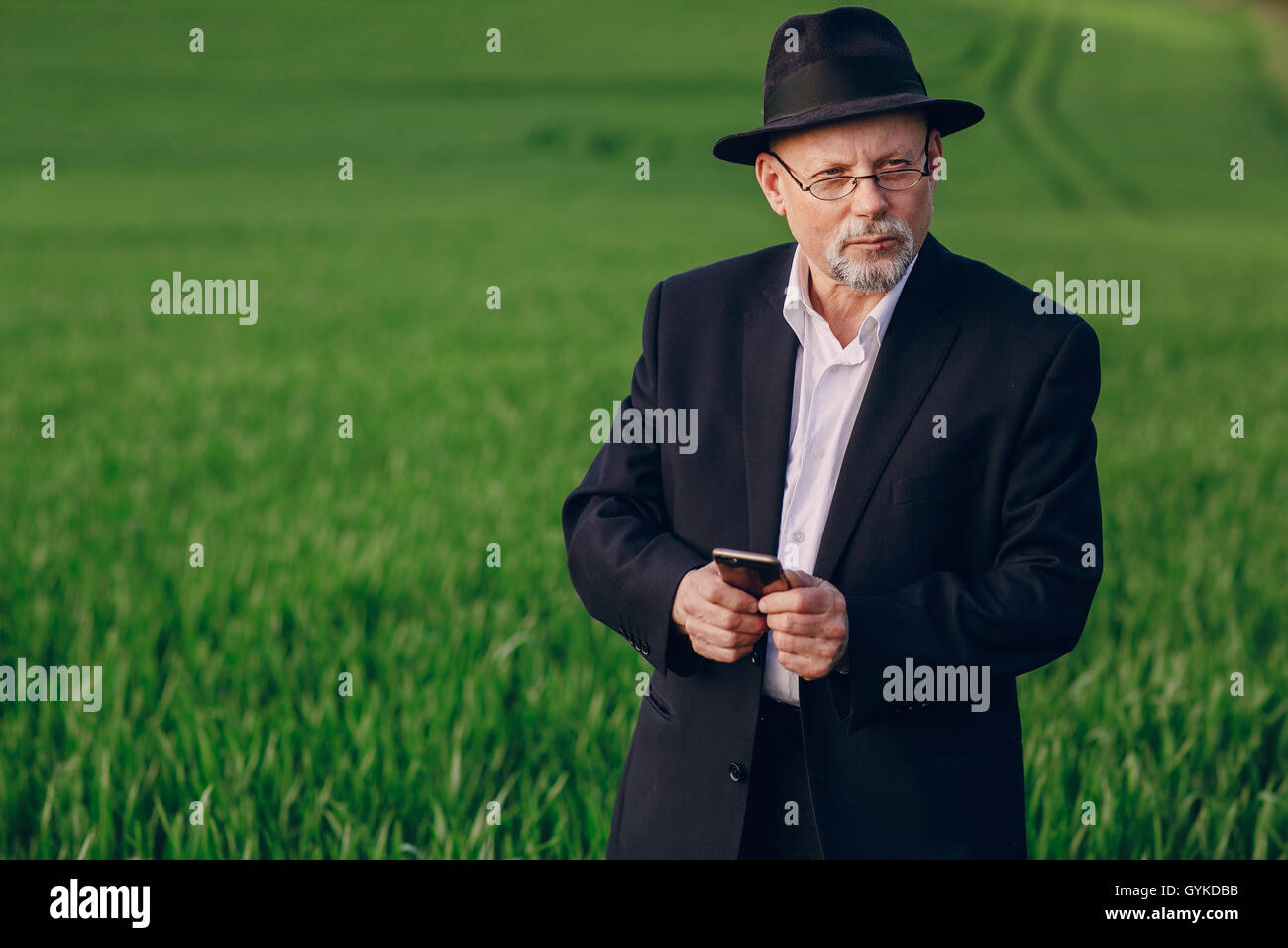 old man in field Stock Photo - Alamy