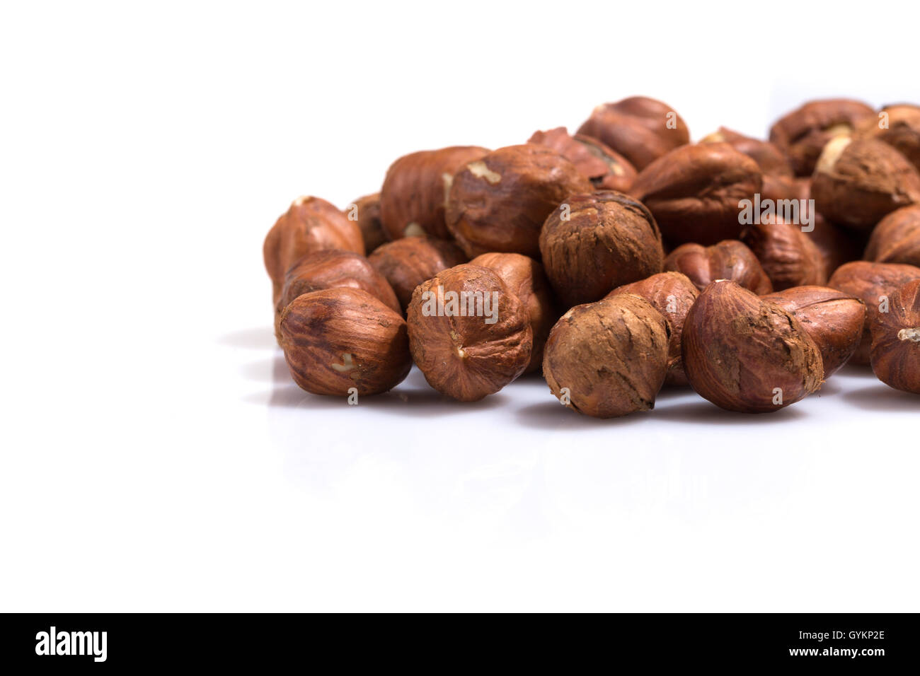 Heap of hazelnuts isolated on white background, macro image Stock Photo ...