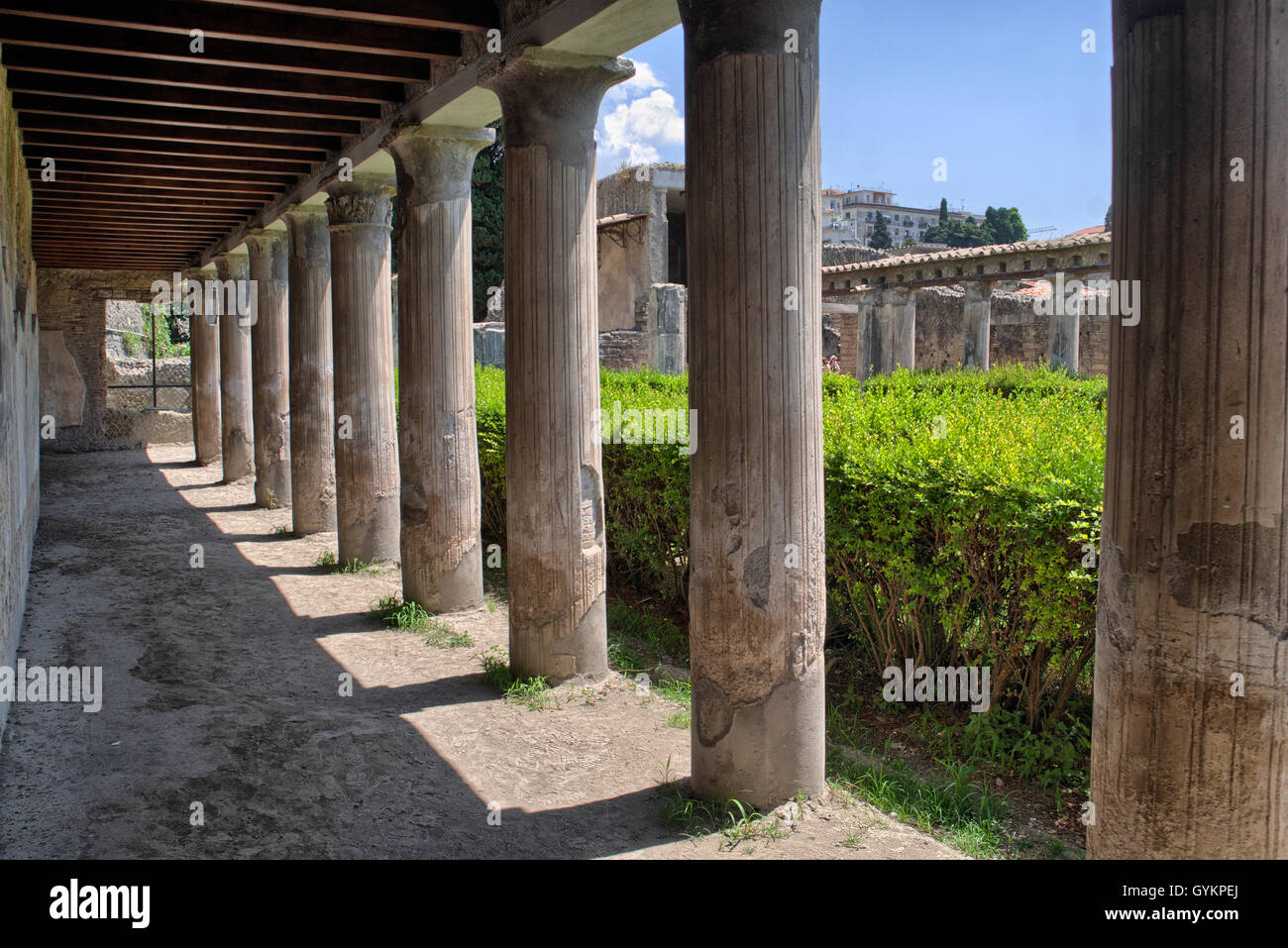 A colonnade in Herculaneum, a Roman port buried during the volcanic ...