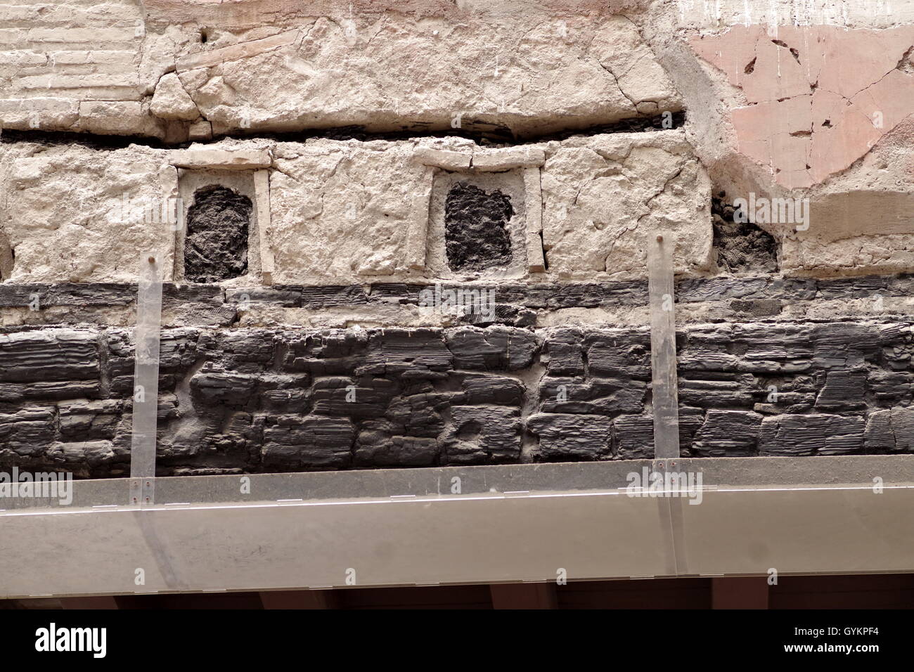 Charred wood in Herculaneum, a Roman port buried during the volcanic ...