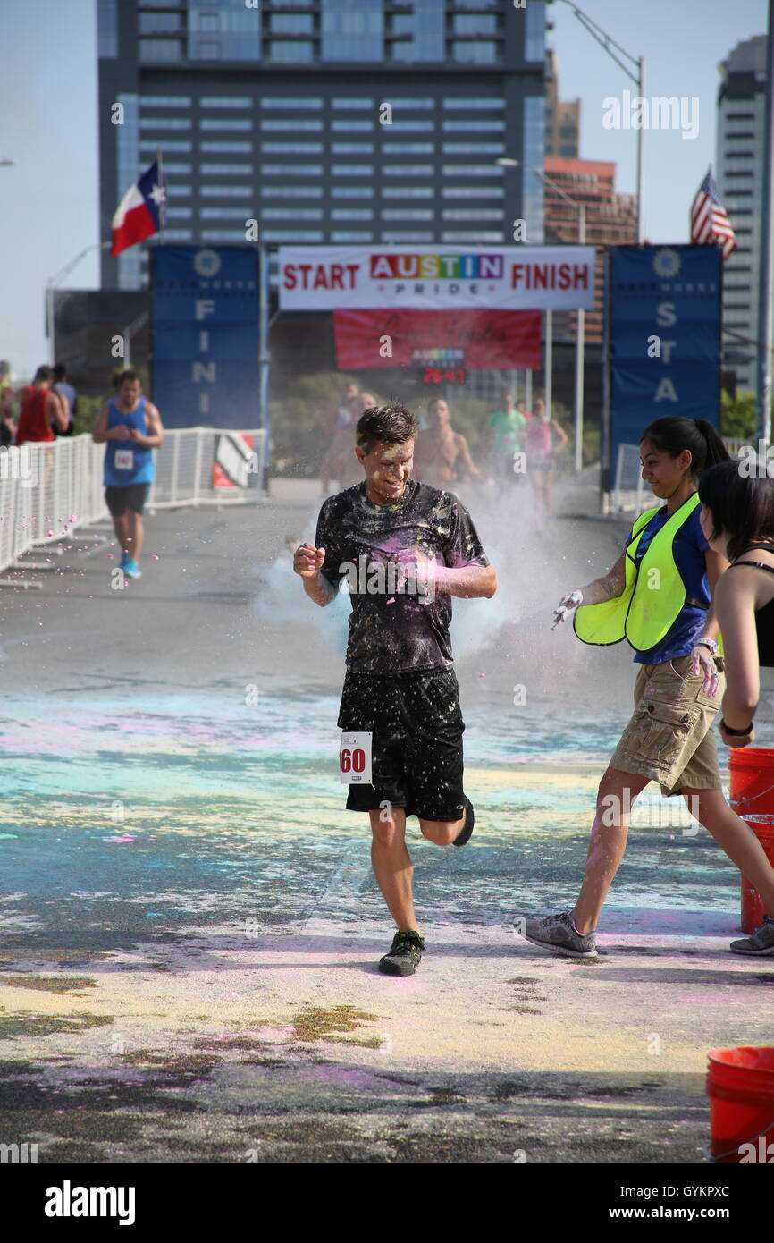 A runner in the Rainbow Run in Austin, Texas Stock Photo - Alamy