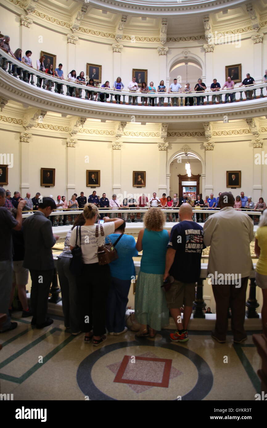 Onlookers watch in the state capital of Austin Texas Stock Photo - Alamy