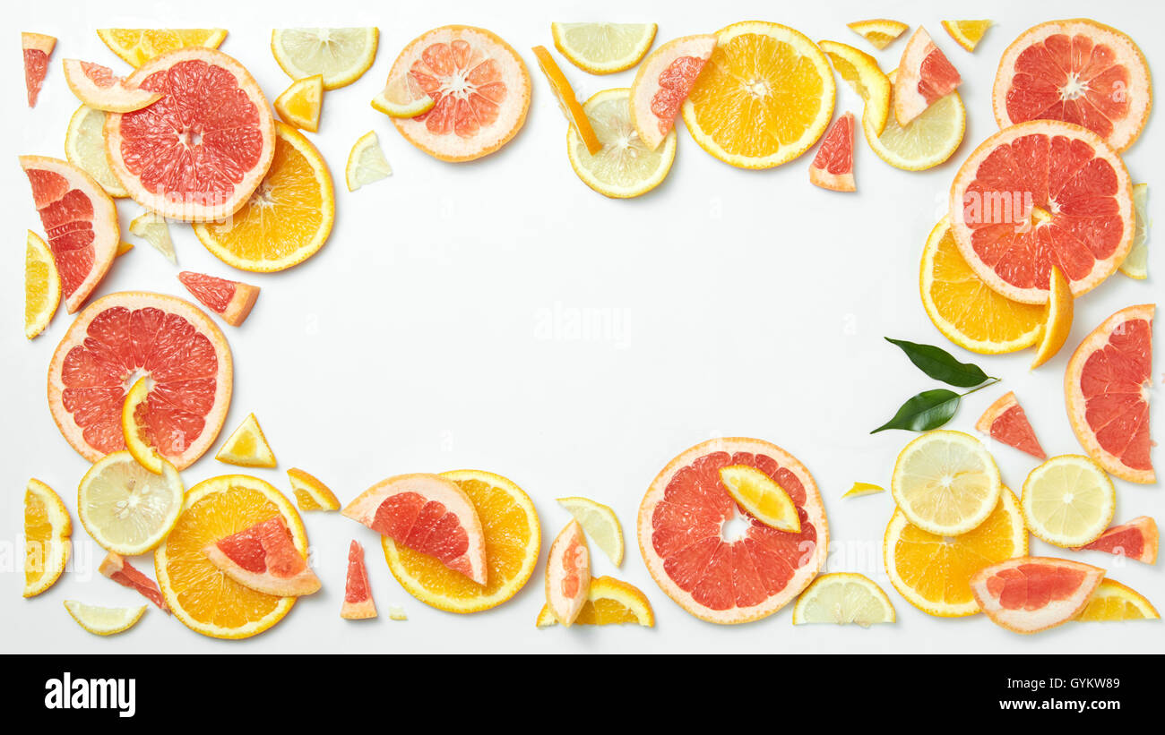citrus fruit frame of citrus slices isolated on white background as a ...