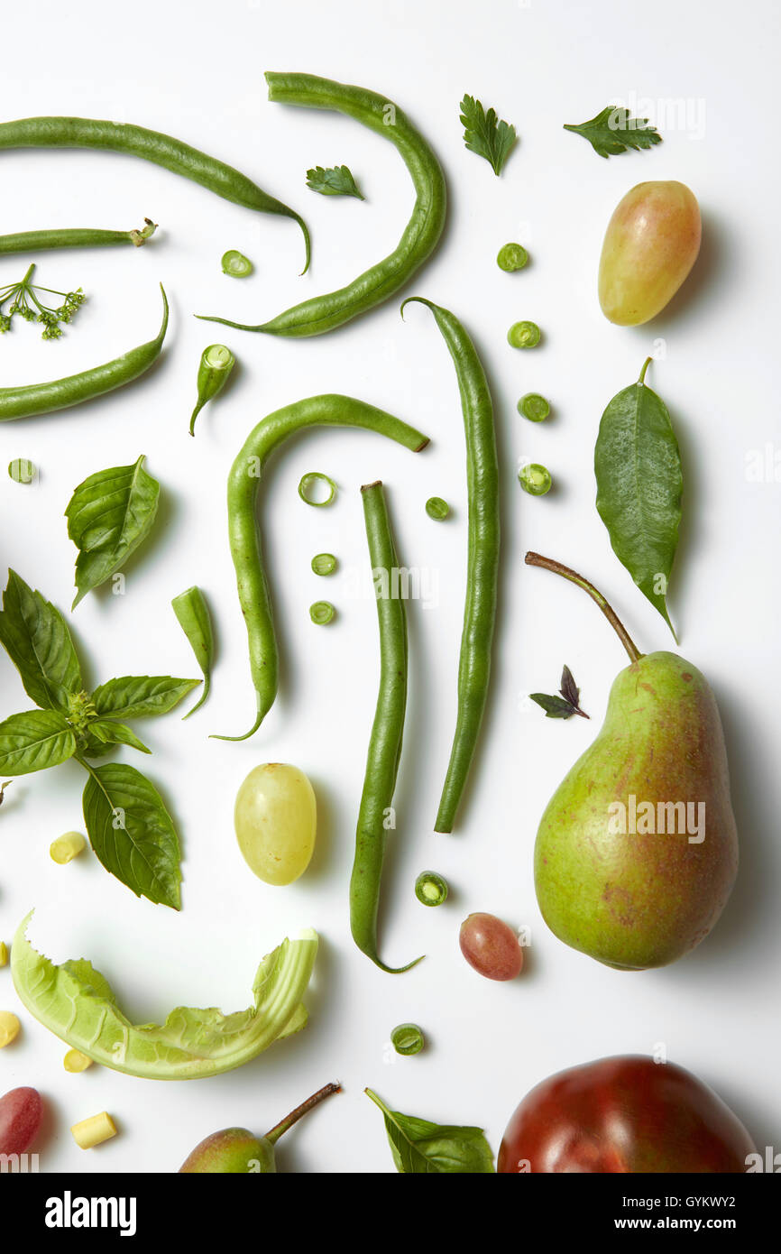 Green vegetables and fruits isolated on white. Ingredients for diet ...