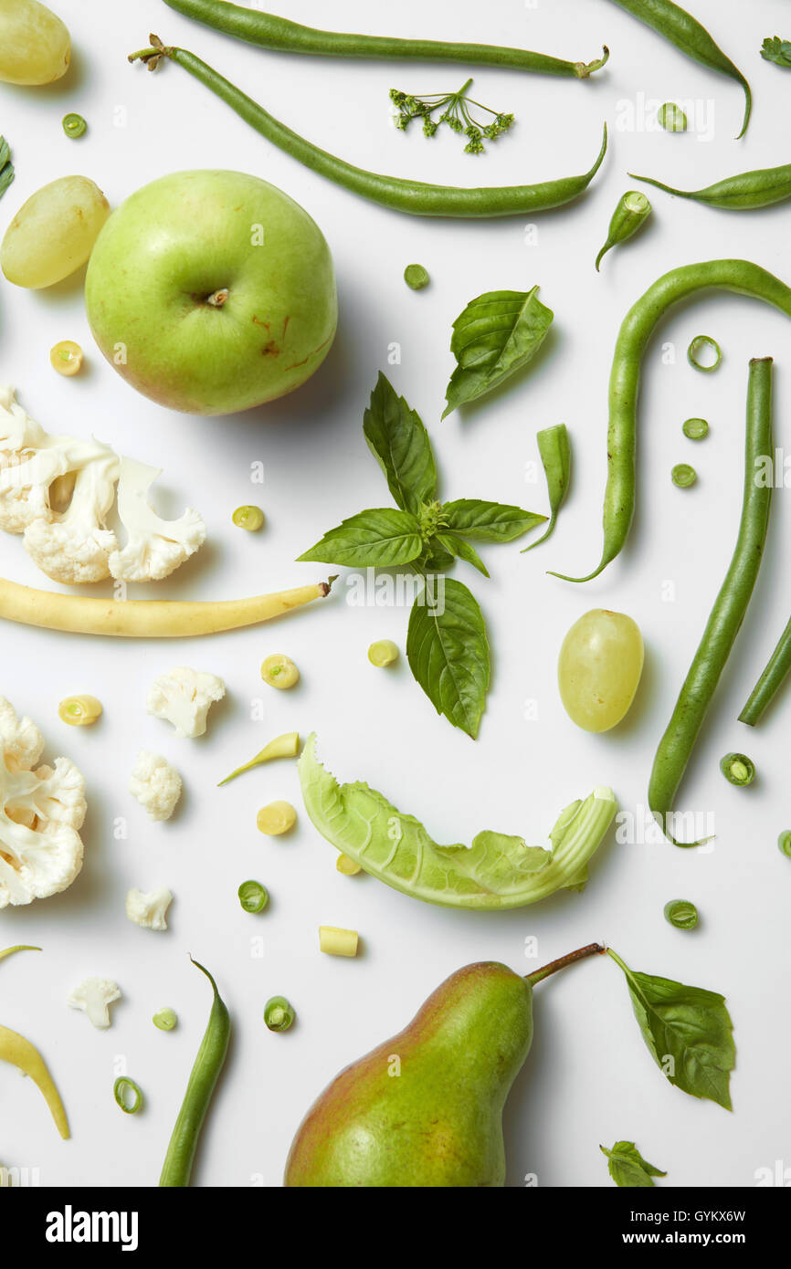 Fresh green vegetables and fruits on whitebackground. Detox, diet or ...