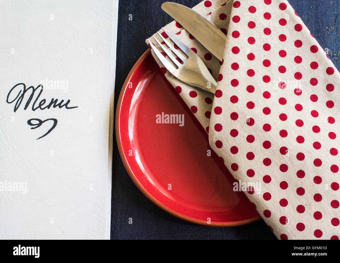 Rustic table setting with vintage plates and silverware Stock Photo - Alamy