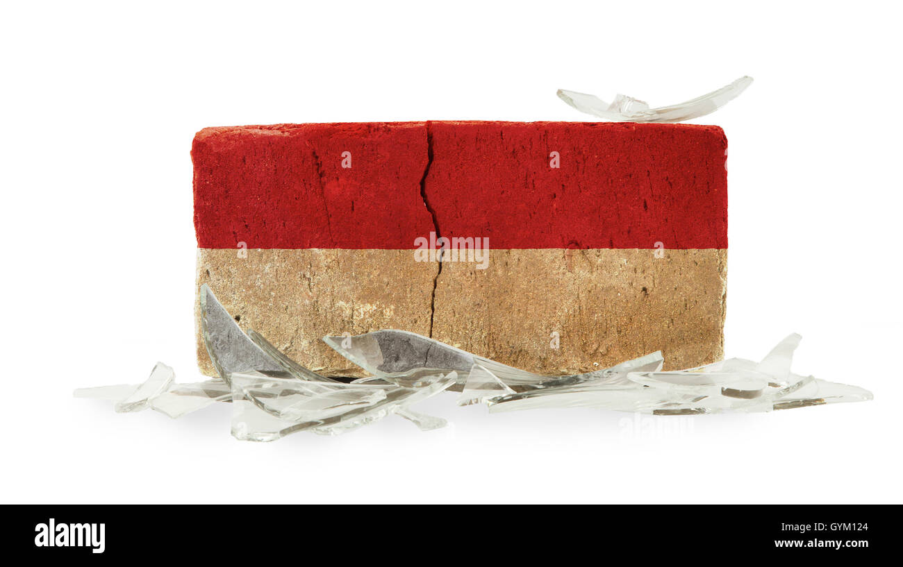 Brick with broken glass, violence concept Stock Photo - Alamy