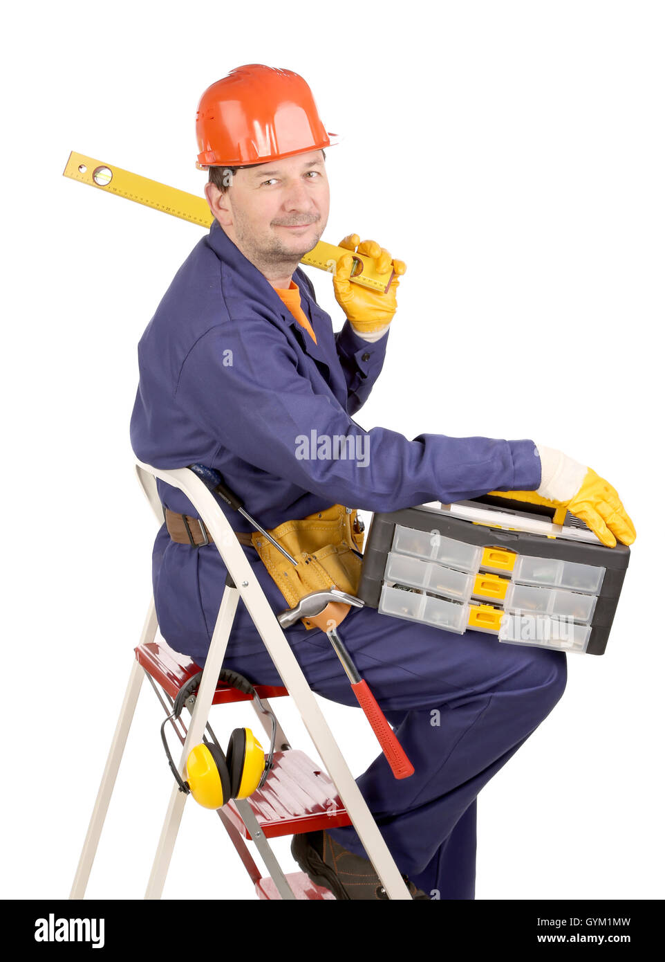 Worker on ladder with ruler and toolbox Stock Photo - Alamy