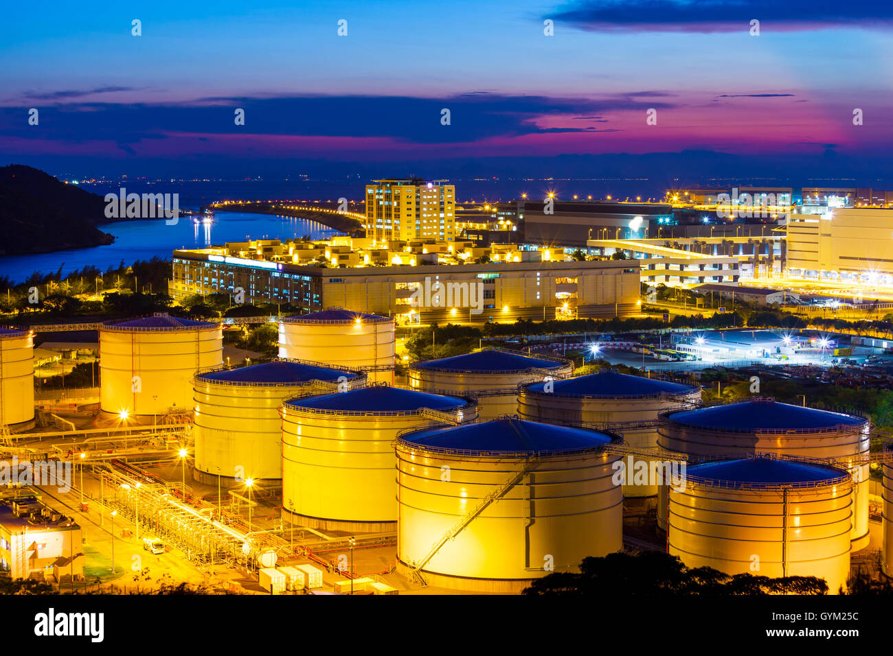 Oil tanks at night Stock Photo - Alamy