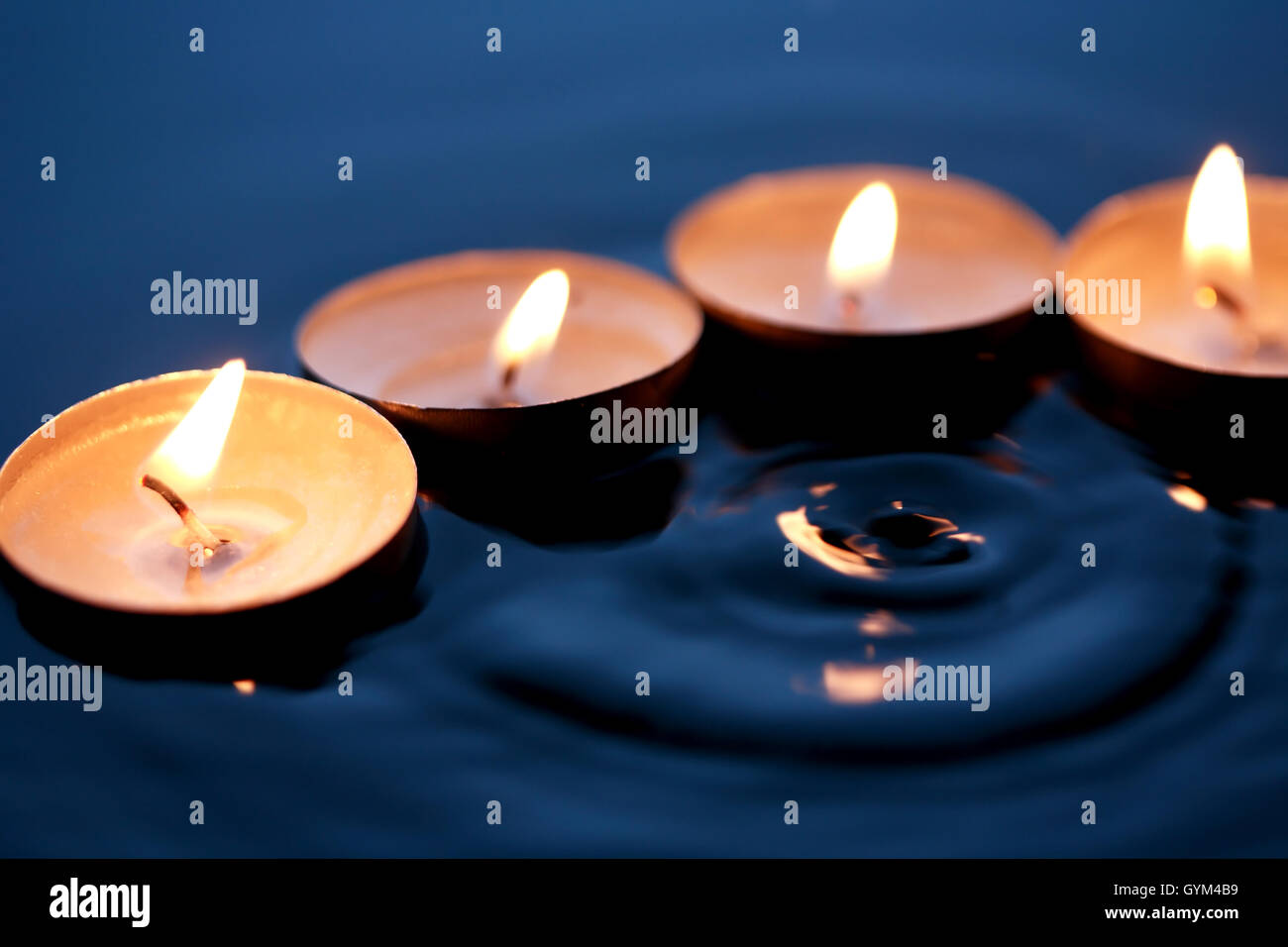 Candles On Water Stock Photo - Alamy