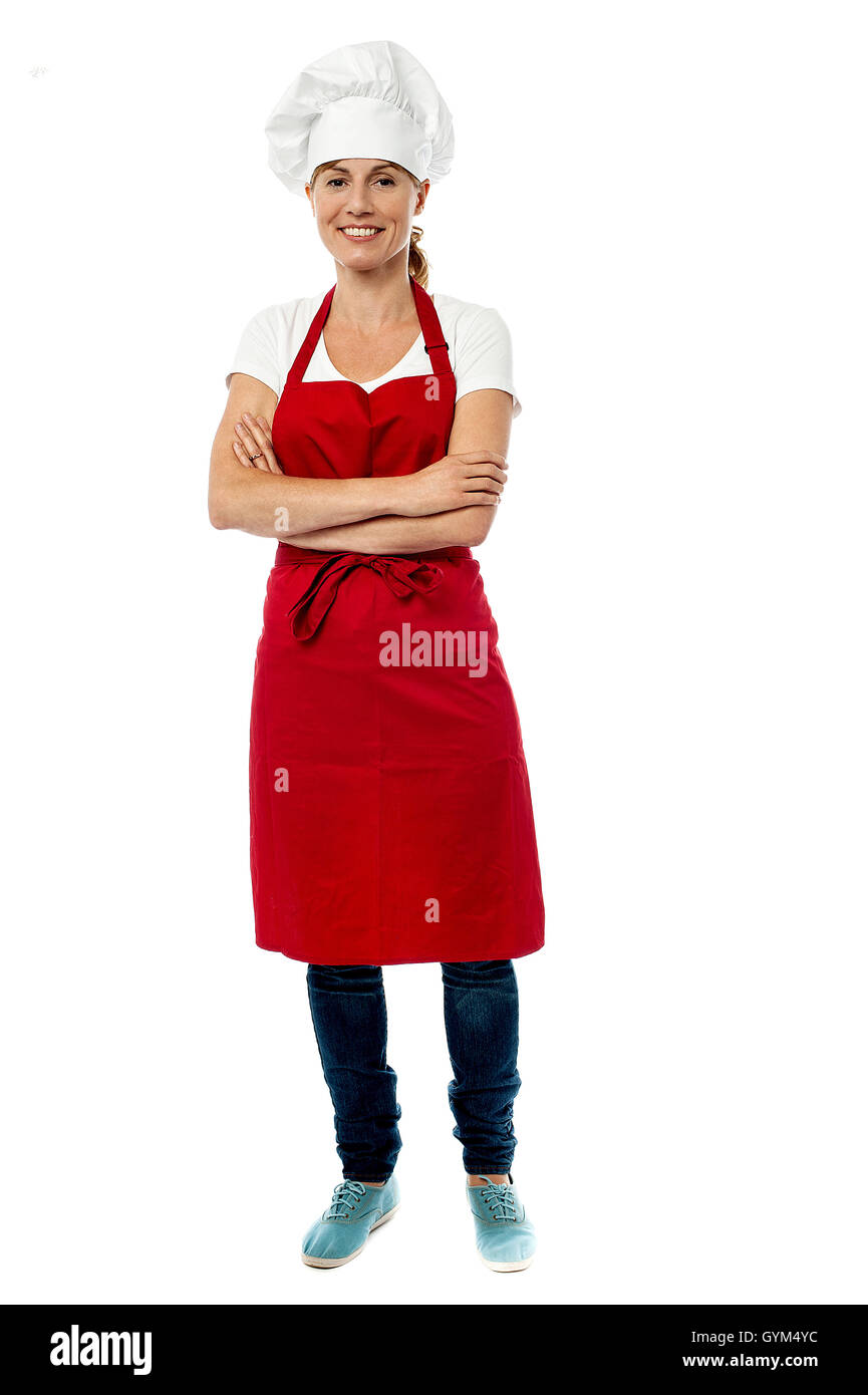 Full length portrait of pretty female chef Stock Photo - Alamy