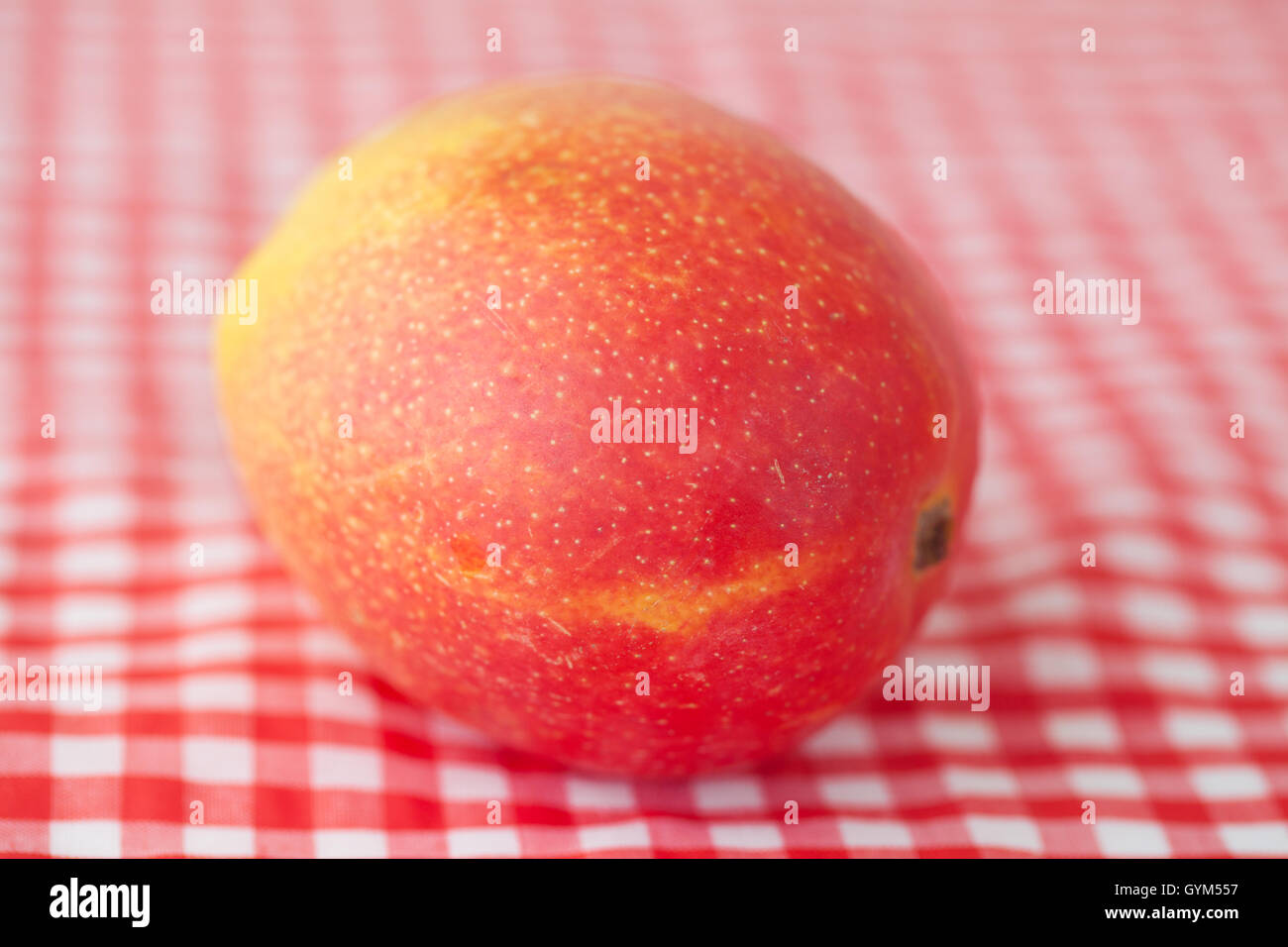 mango fruit on checkered fabric Stock Photo - Alamy