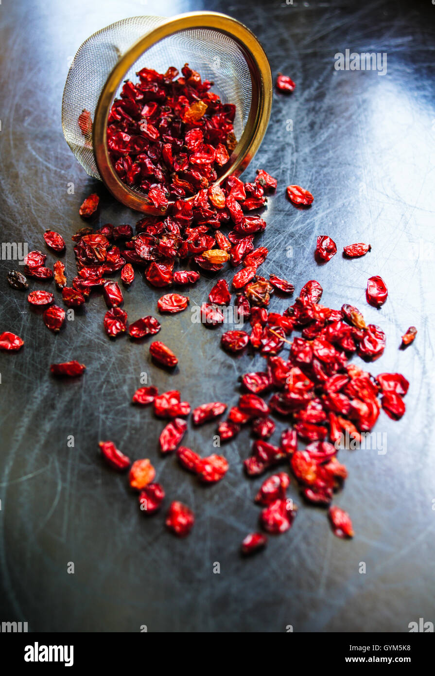 dried goji berries on the rustic style old table Stock Photo - Alamy