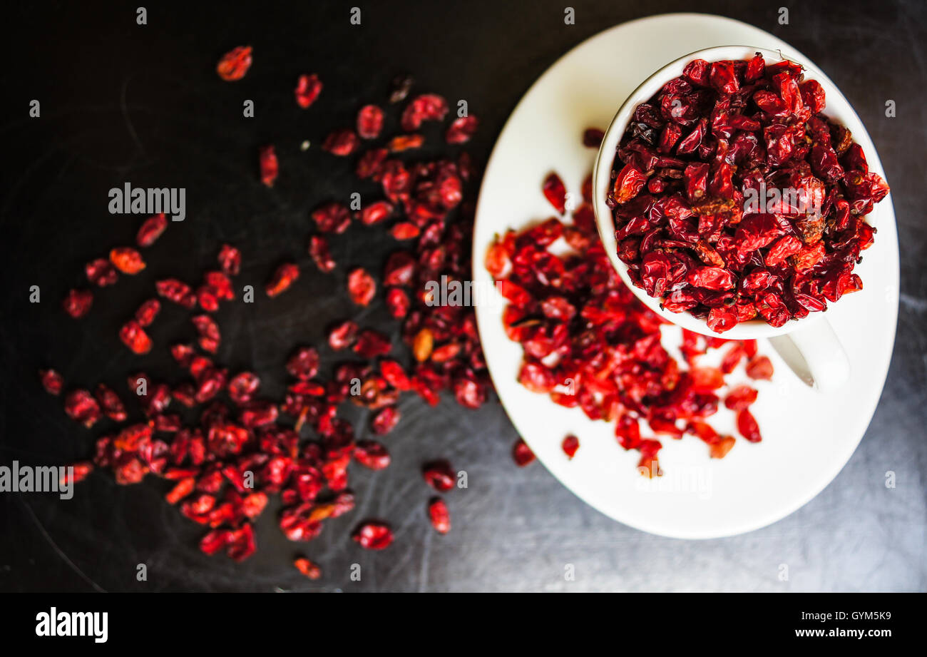 dried goji berries on the rustic style old table Stock Photo - Alamy