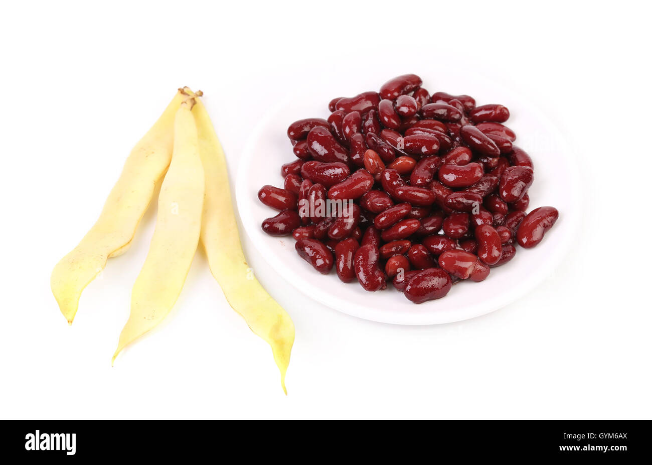 Yellow pods and red beans Stock Photo - Alamy