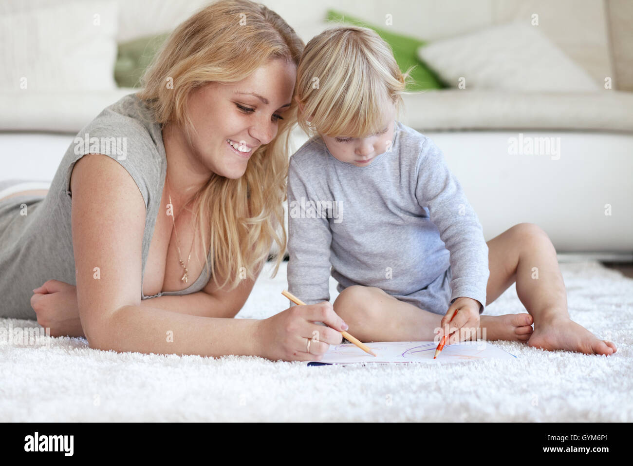 Family at home Stock Photo - Alamy