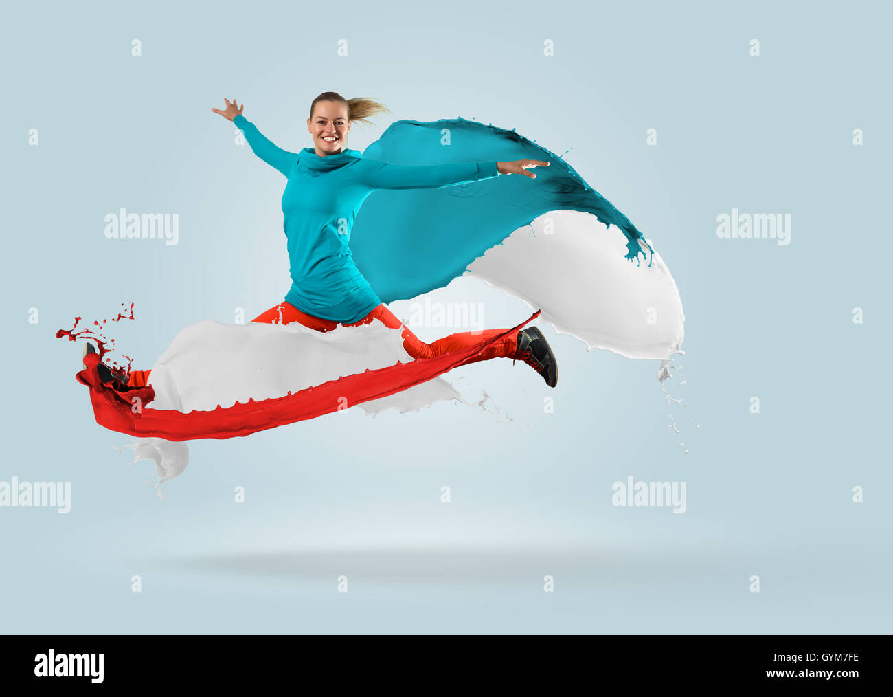 young female dancer jumping with splash of paint Stock Photo - Alamy