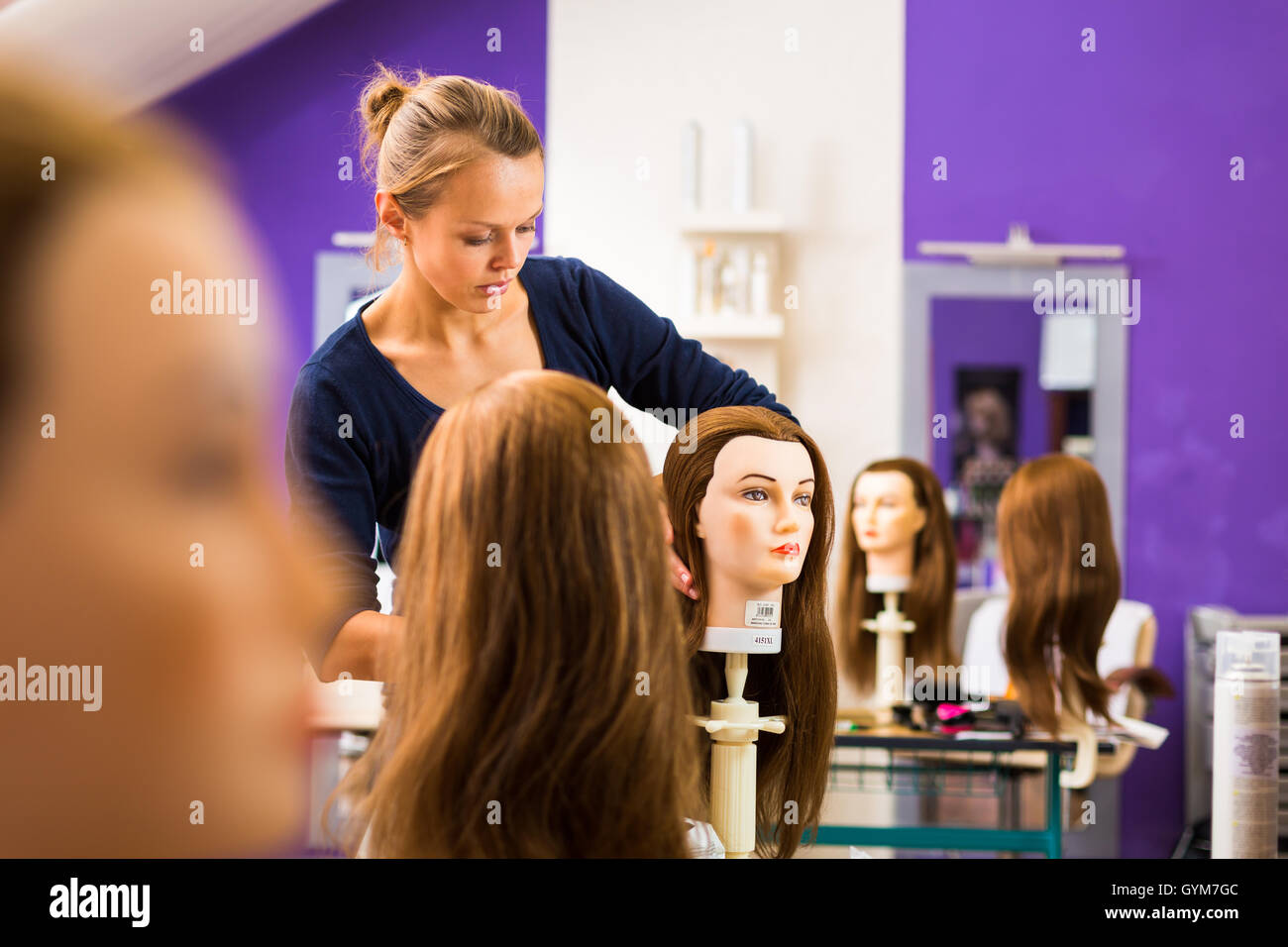 Pretty female hairdresser/haidressing apprentice/student Stock Photo ...