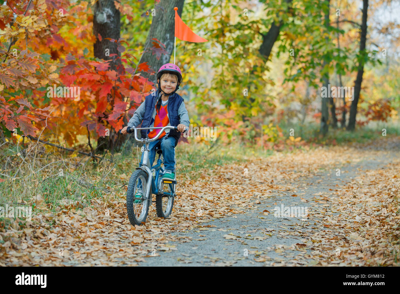 Little boy on bicycle Stock Photo - Alamy