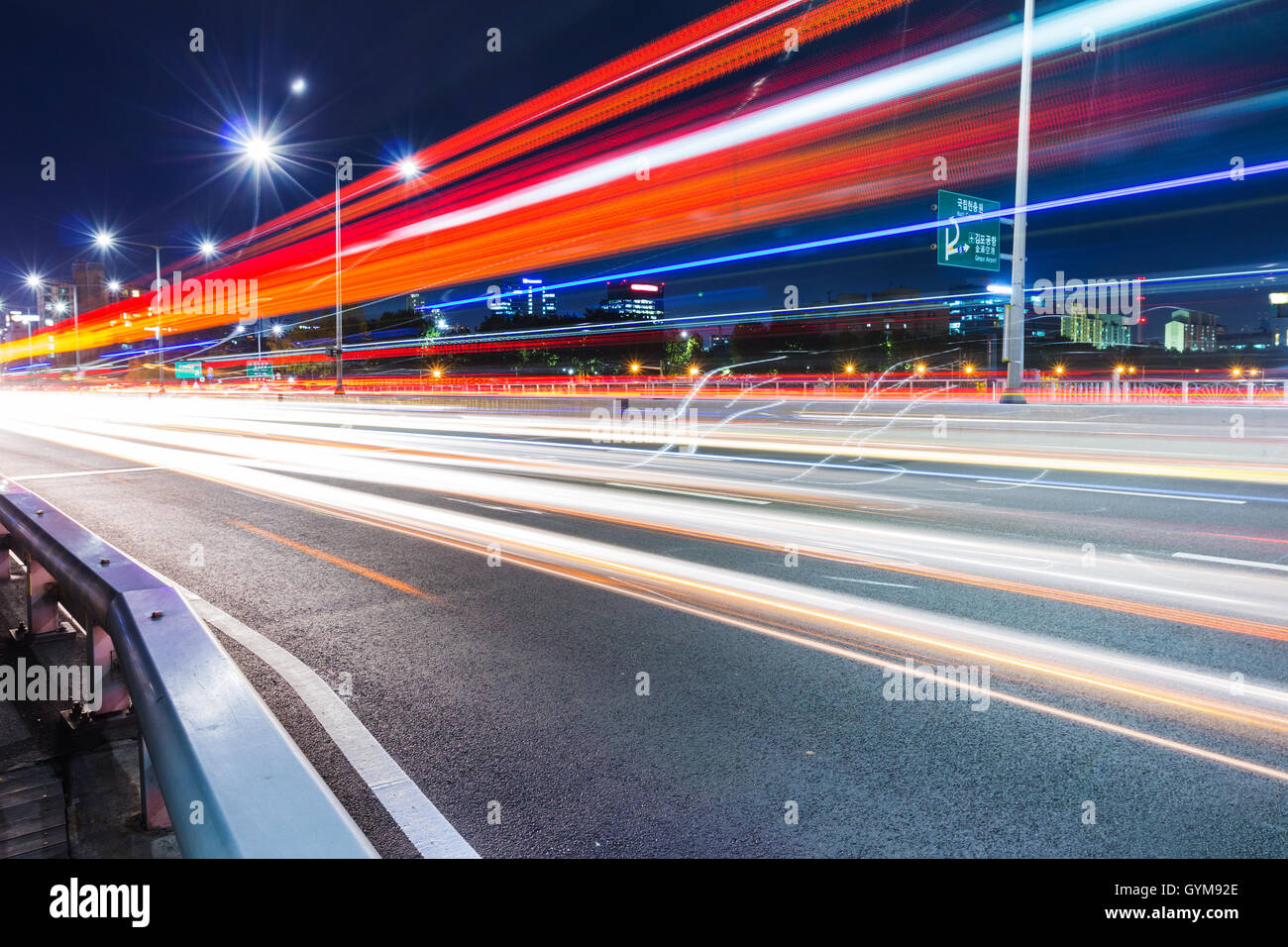Busy traffic on highway at night Stock Photo - Alamy
