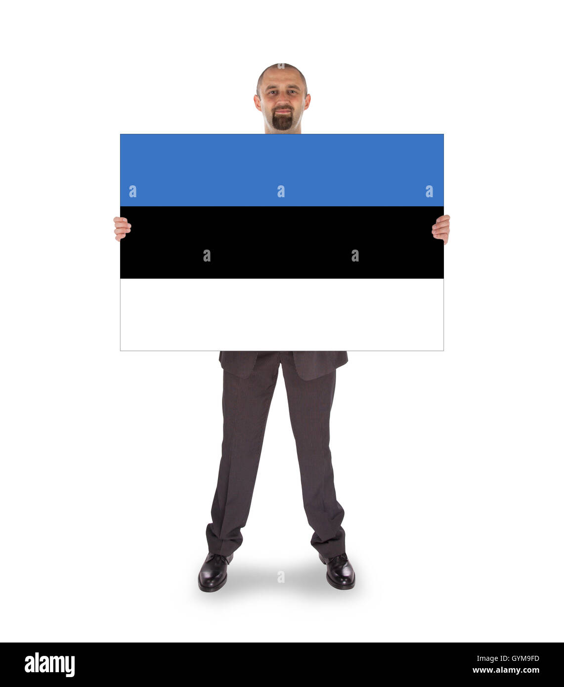 Smiling businessman holding a big card or flag Stock Photo - Alamy