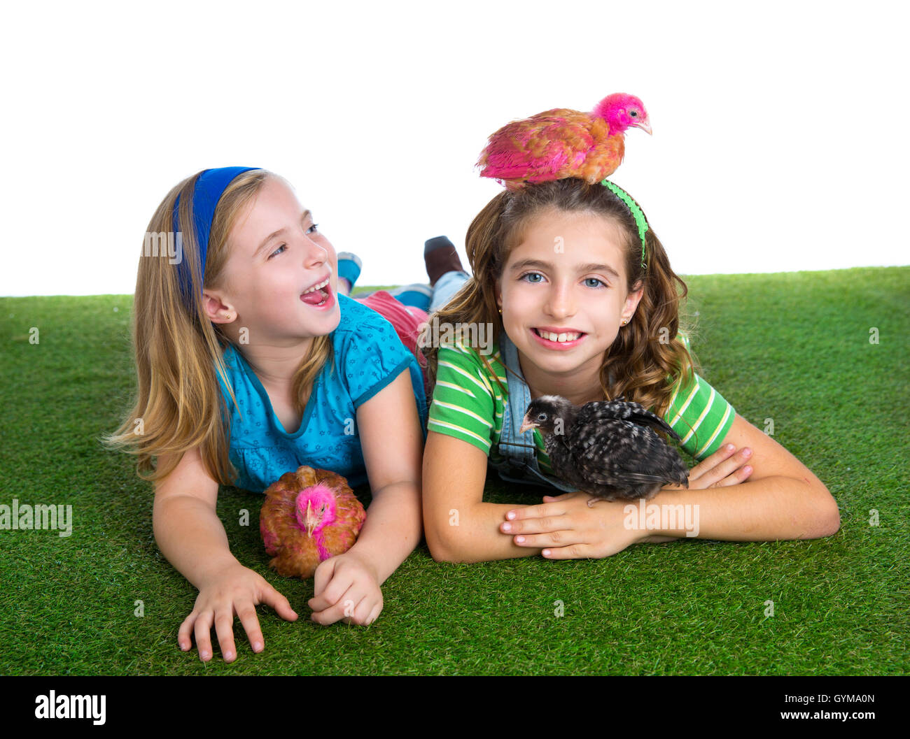 breeder hens kid sister farmer girls having fun with chicken chi Stock ...