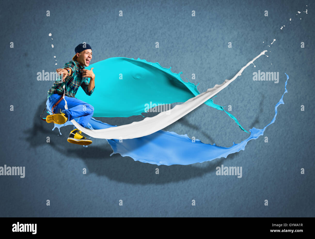 young male dancer jumping with splash of paint Stock Photo - Alamy