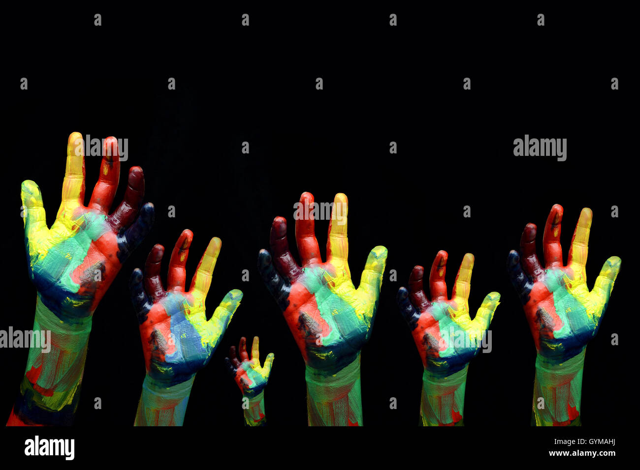 Children Handss seeking for Help SOS concept on black background Stock ...