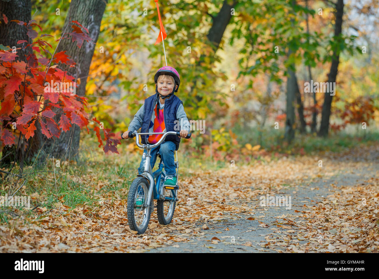 Little boy on bicycle Stock Photo - Alamy