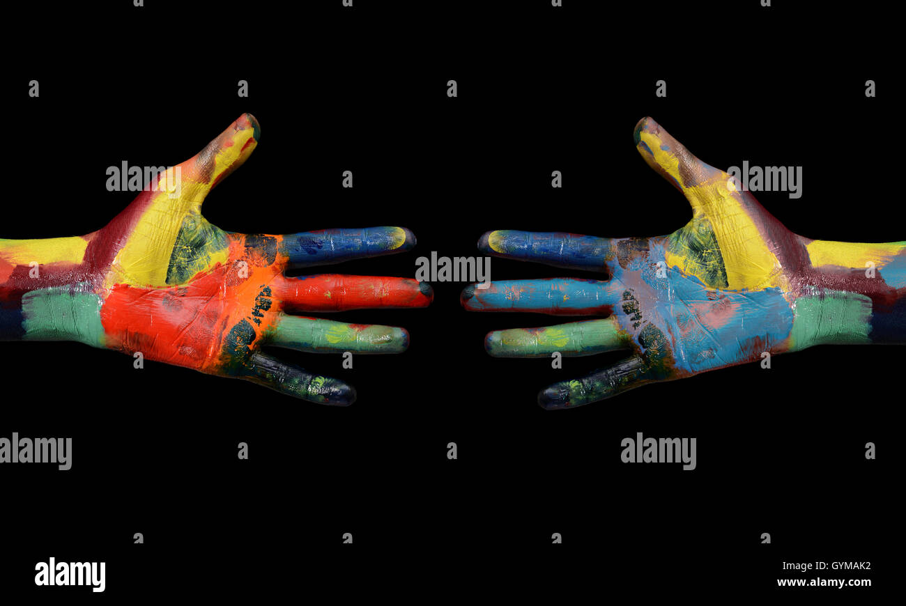Two Multi Color painted hands coming to each other Stock Photo - Alamy