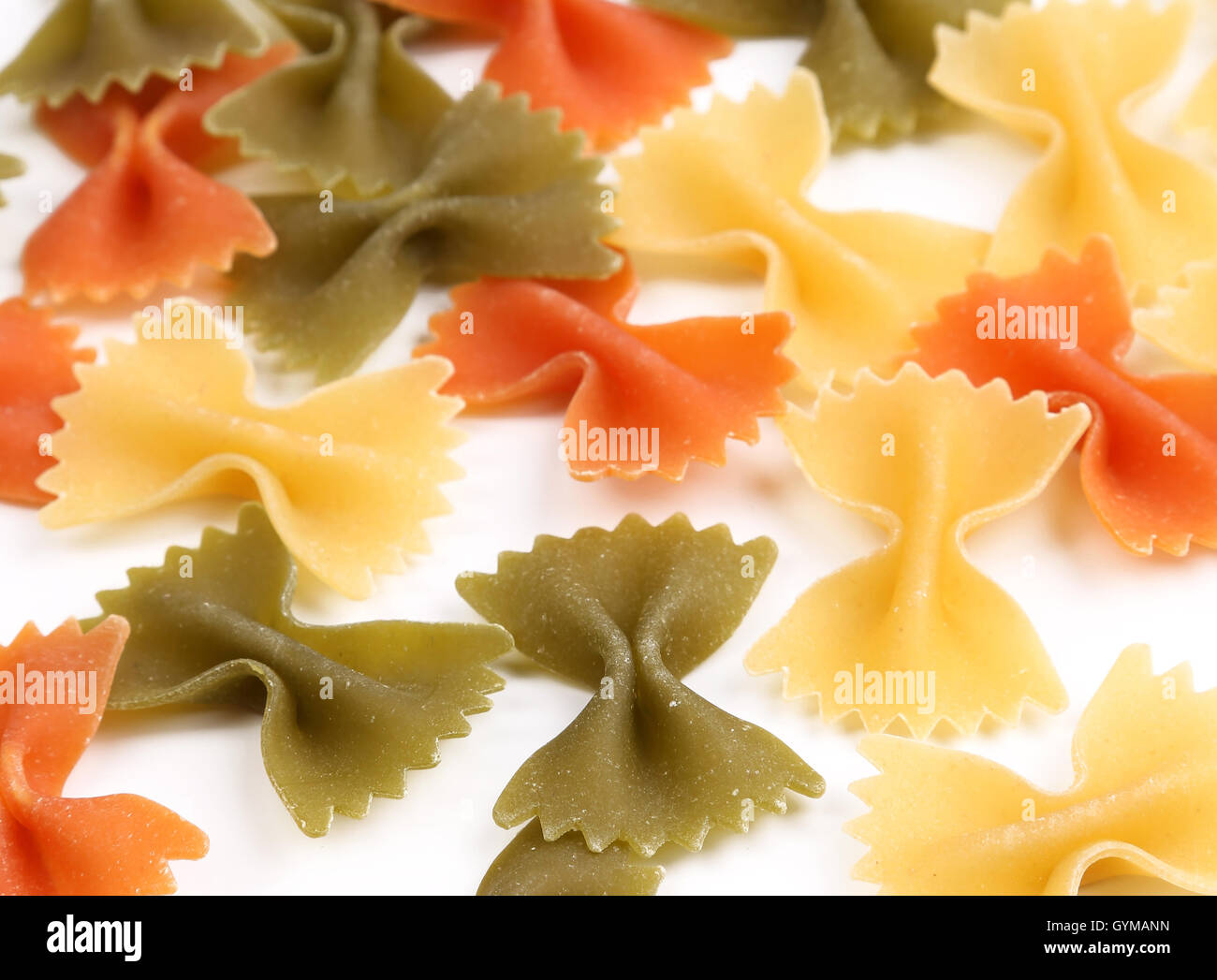Farfalle pasta three colors Stock Photo - Alamy