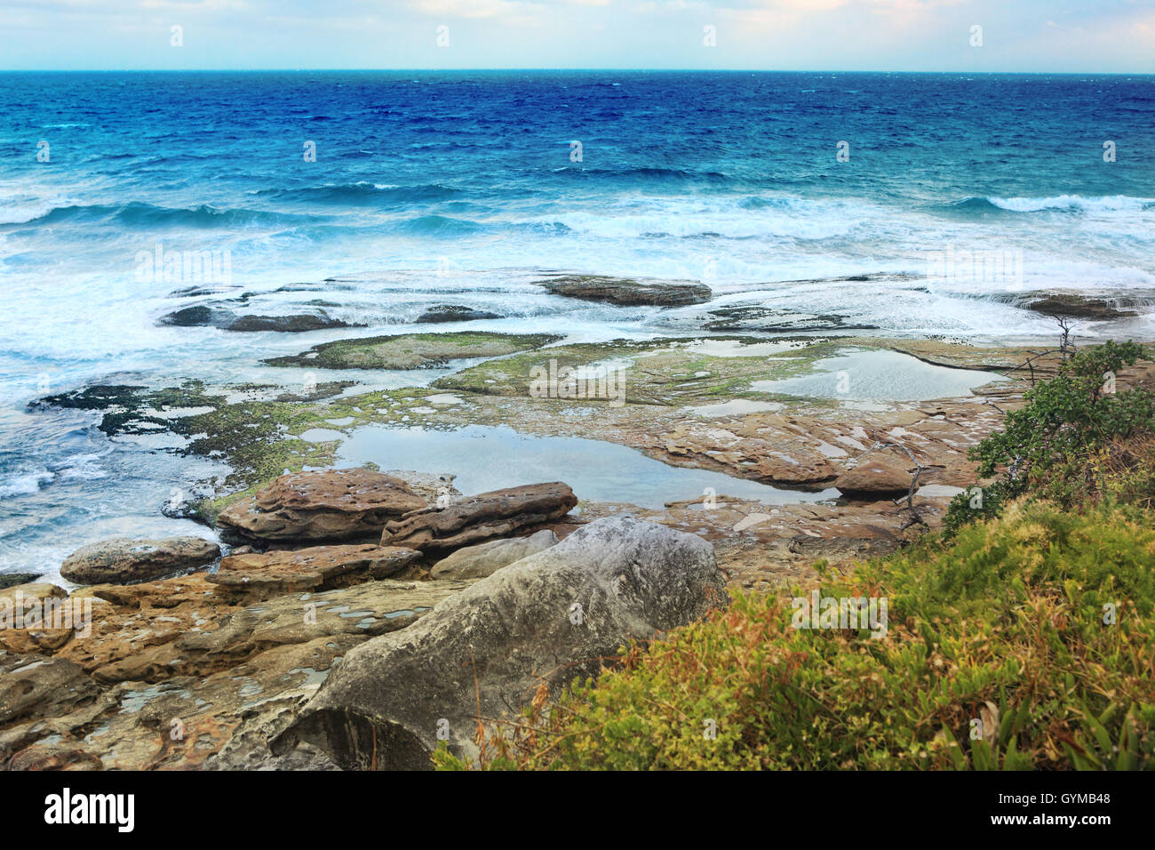 Tidal rocks Tamarama Stock Photo - Alamy