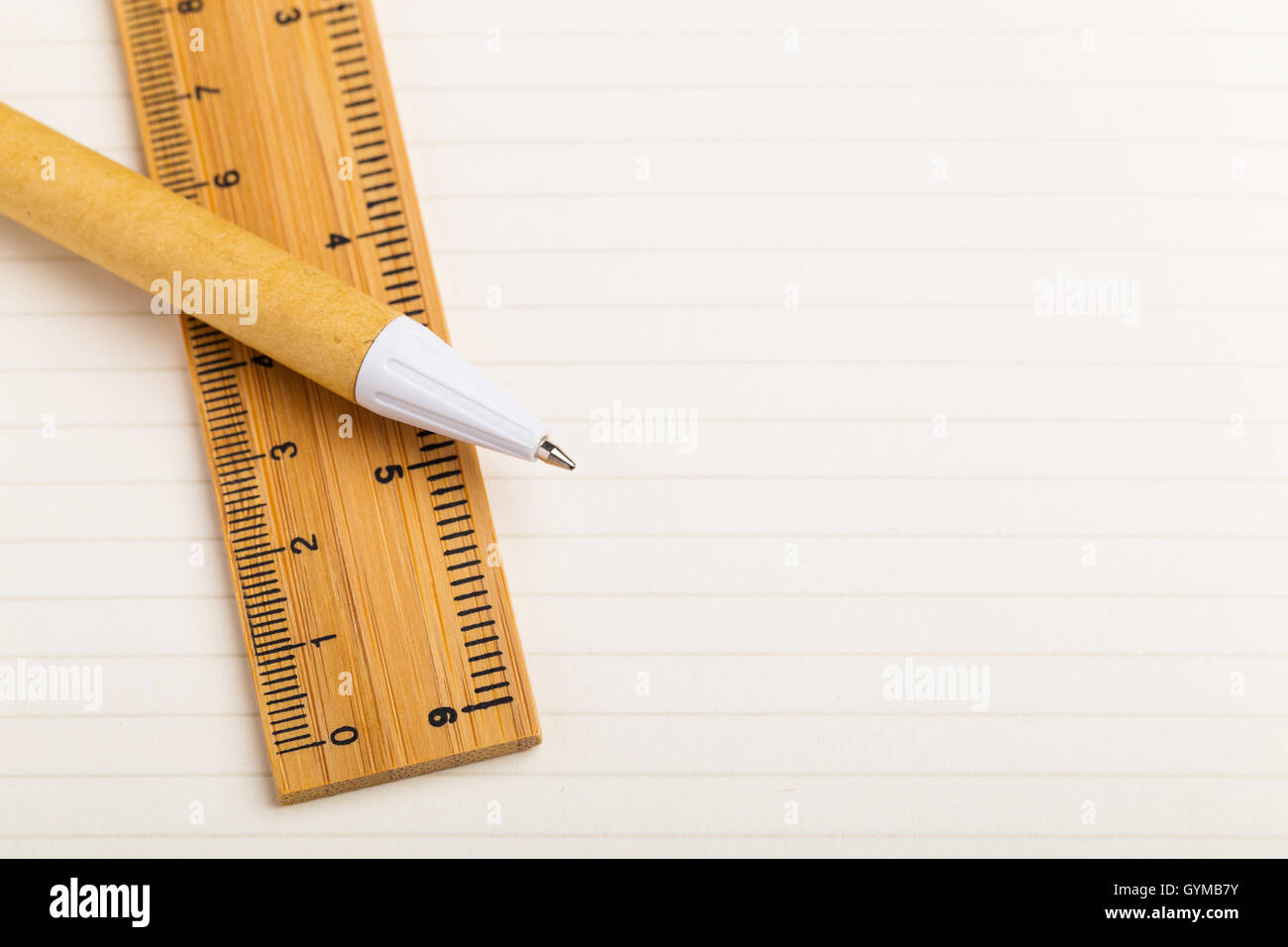 Pen and ruler on the single line paper Stock Photo - Alamy