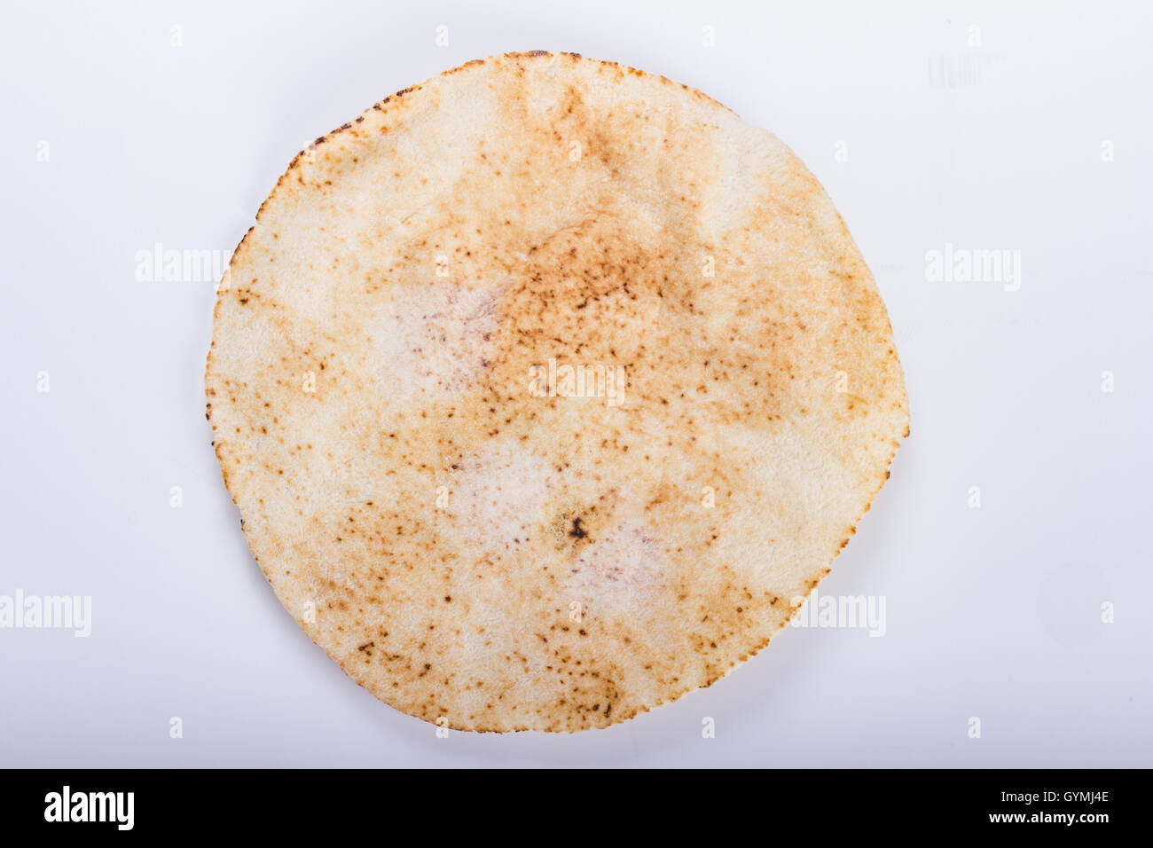 One wheat pita bread isolated on white Stock Photo - Alamy
