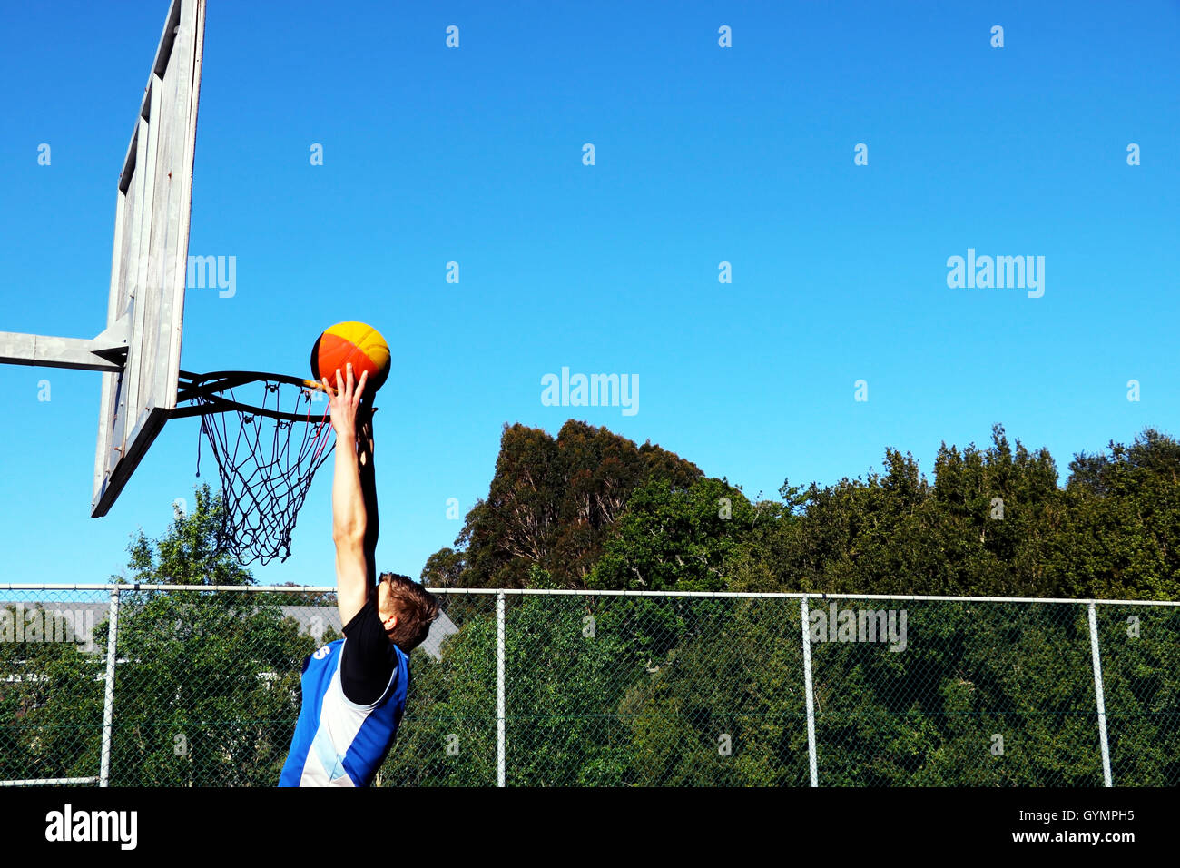 Two handed basketball dunk Stock Photo - Alamy
