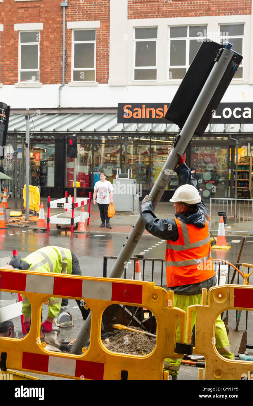 Road workers Manual work Fitting signs High visibility clothing Stock ...
