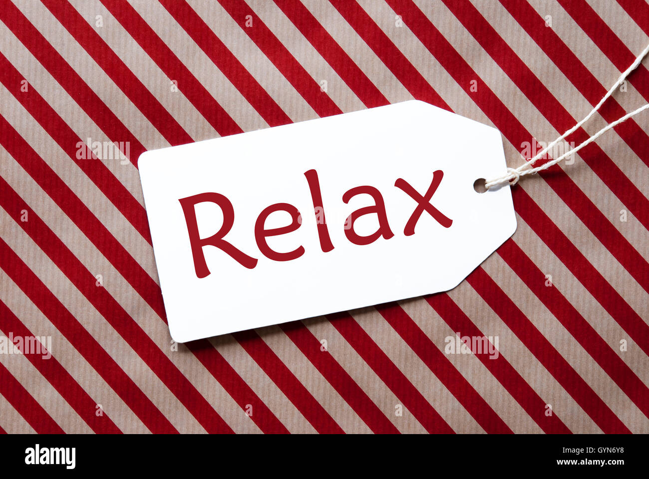 Label On Red Wrapping Paper, Text Relax Stock Photo - Alamy