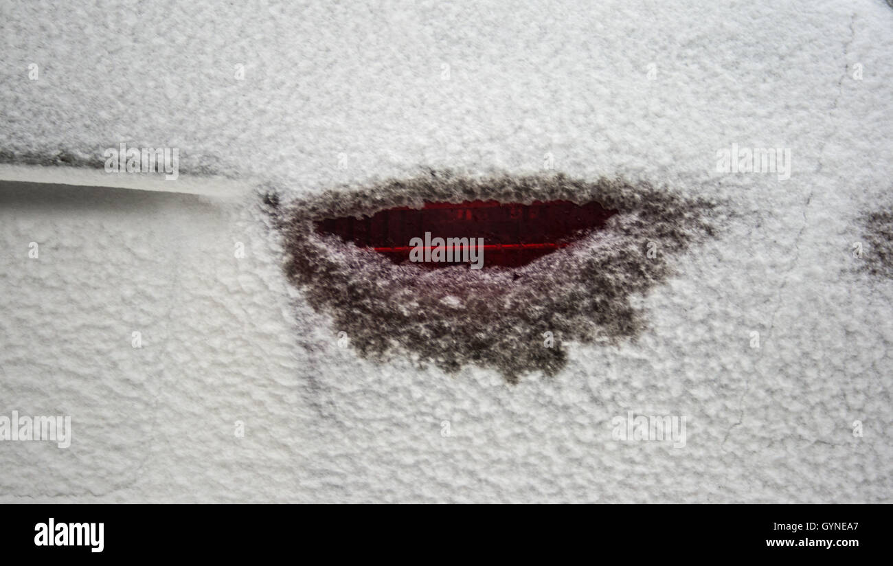 December 17, 2009 - Tail light of cars covered with snow during a ...