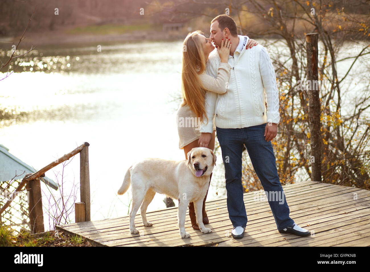 Couple with dog Stock Photo - Alamy