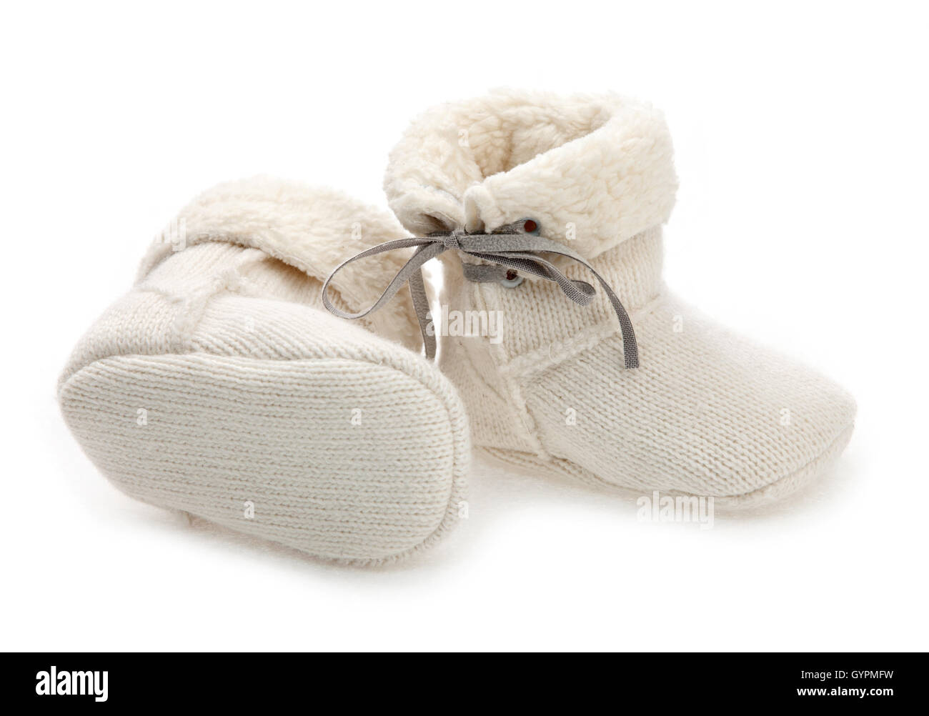 Pair of baby booties over white Stock Photo - Alamy