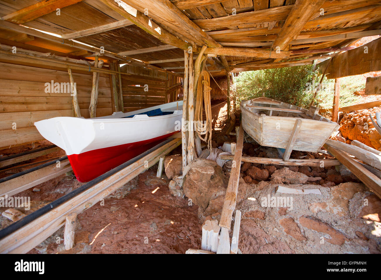 Formentera Cala Saona beach rail beached boats Stock Photo - Alamy